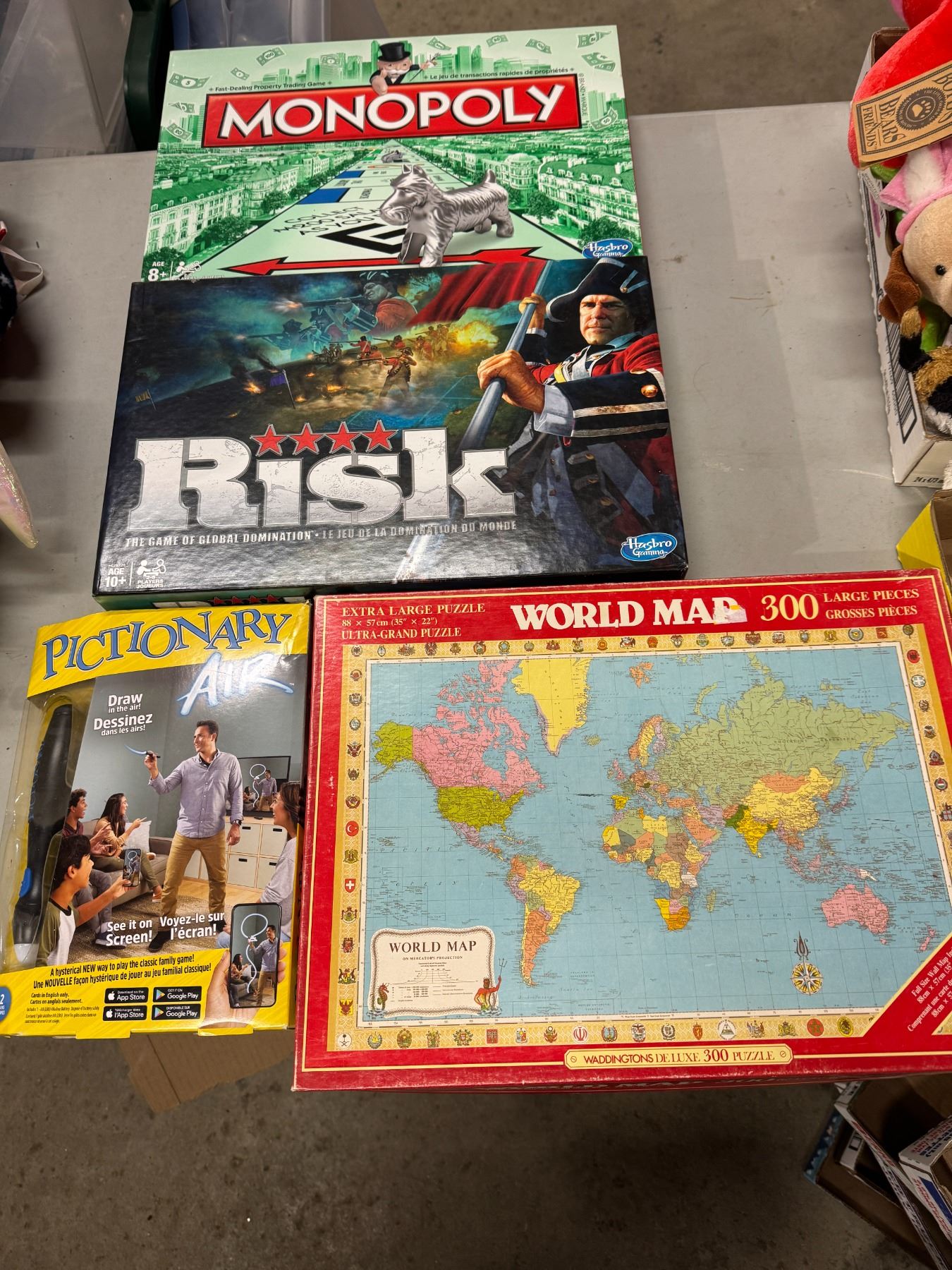 Air, Pictionary, Monopoly, wrist and world map puzzle