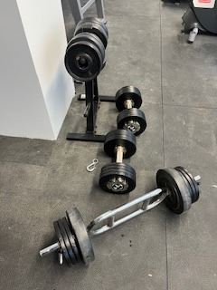 Various bar bells and weights