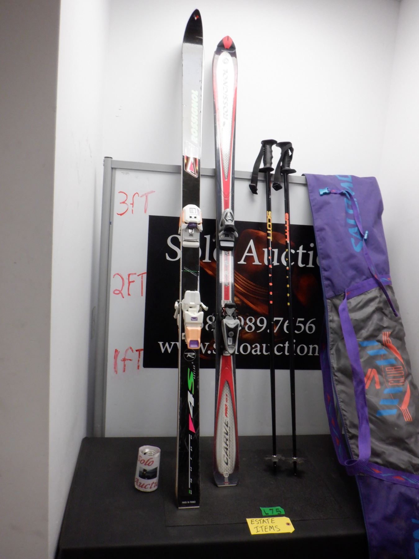 2 sets of downhill skis' and one set of poles with carrying case