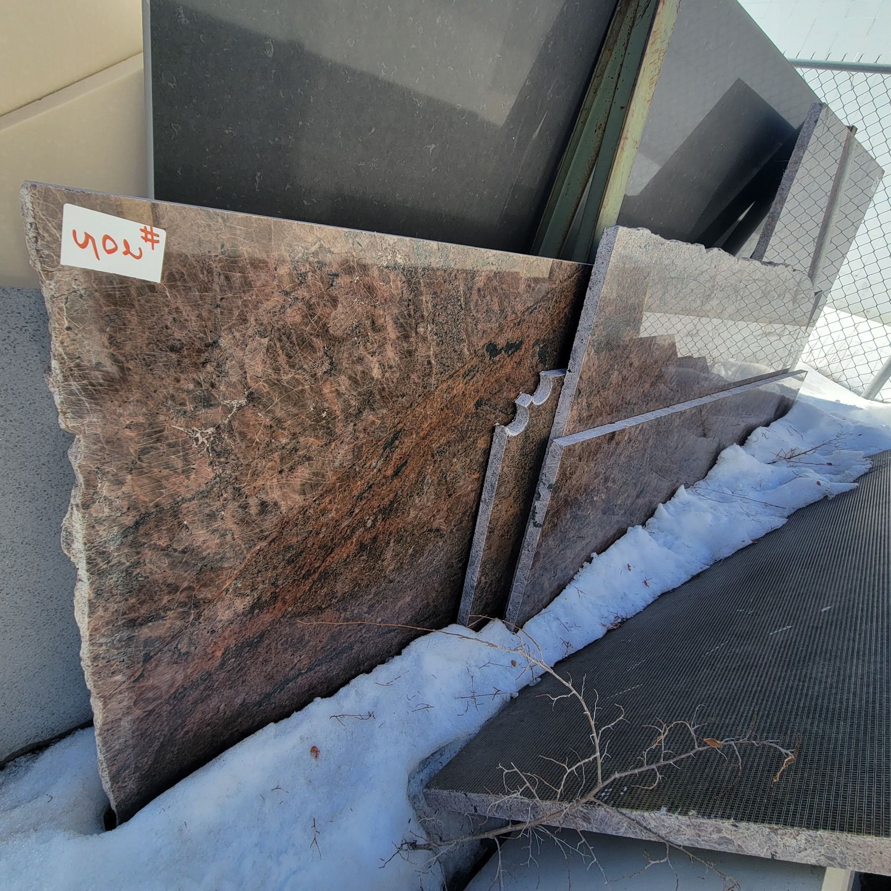 Qty of partial slabs of antique persa granite & qty of various partial ...