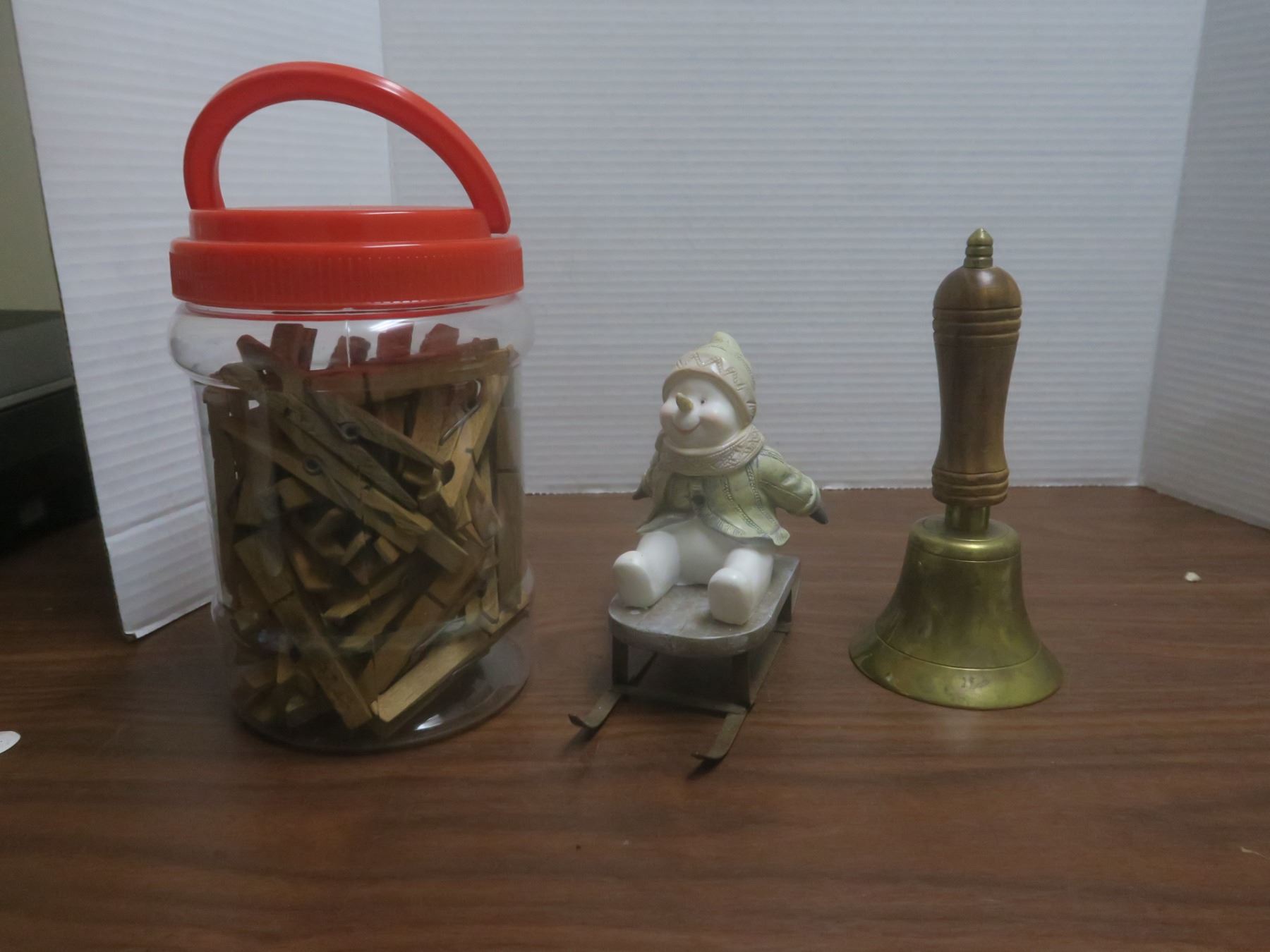 bell, snowman on sleigh and old clothes pins