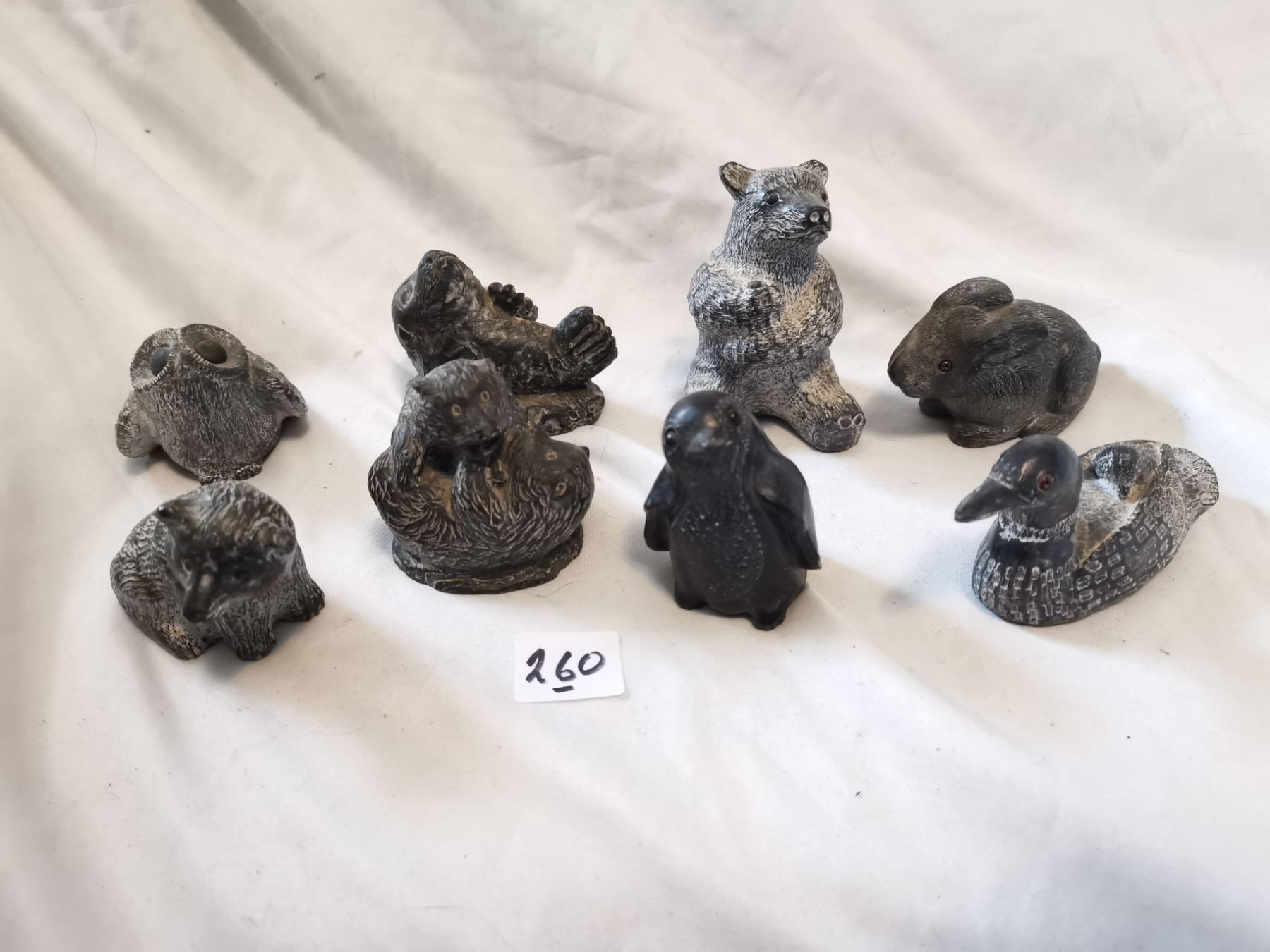 eight wolves original soapstone figurines - Schmalz Auctions