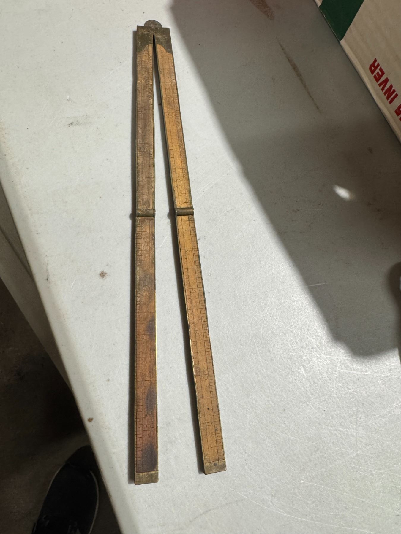 Antique measure stick holding