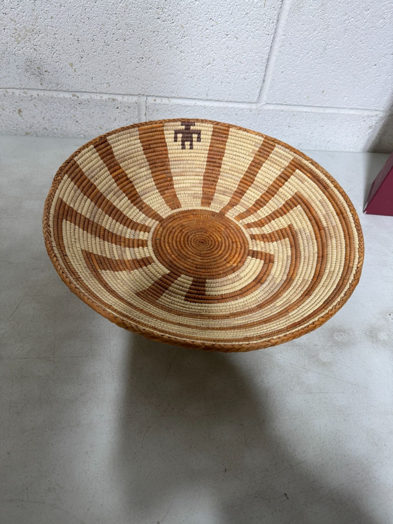 Native American man in the maze basket