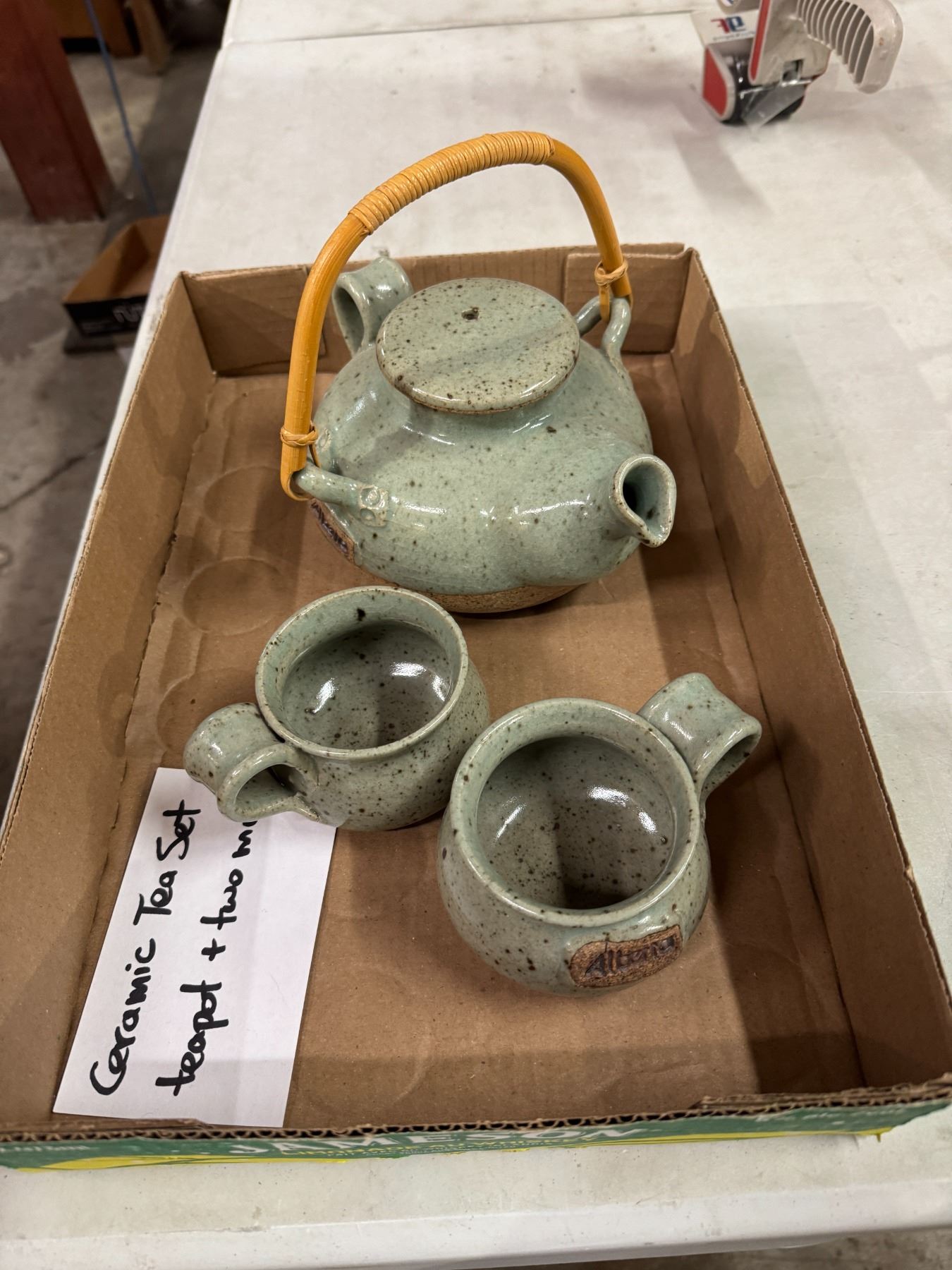 Ceramic teapot and two mugs
