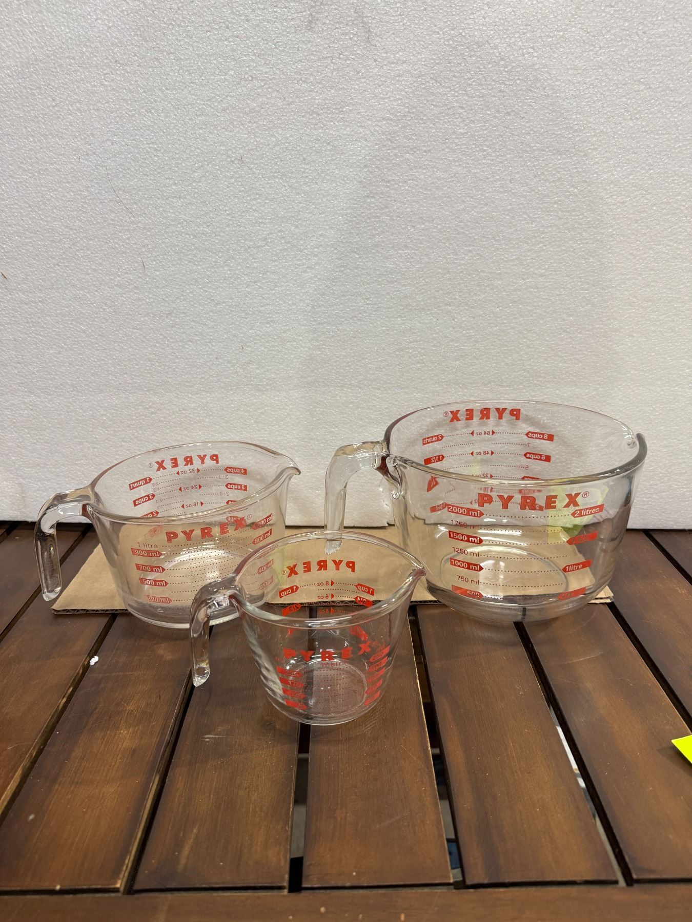 Three glass Pyrex measuring cups