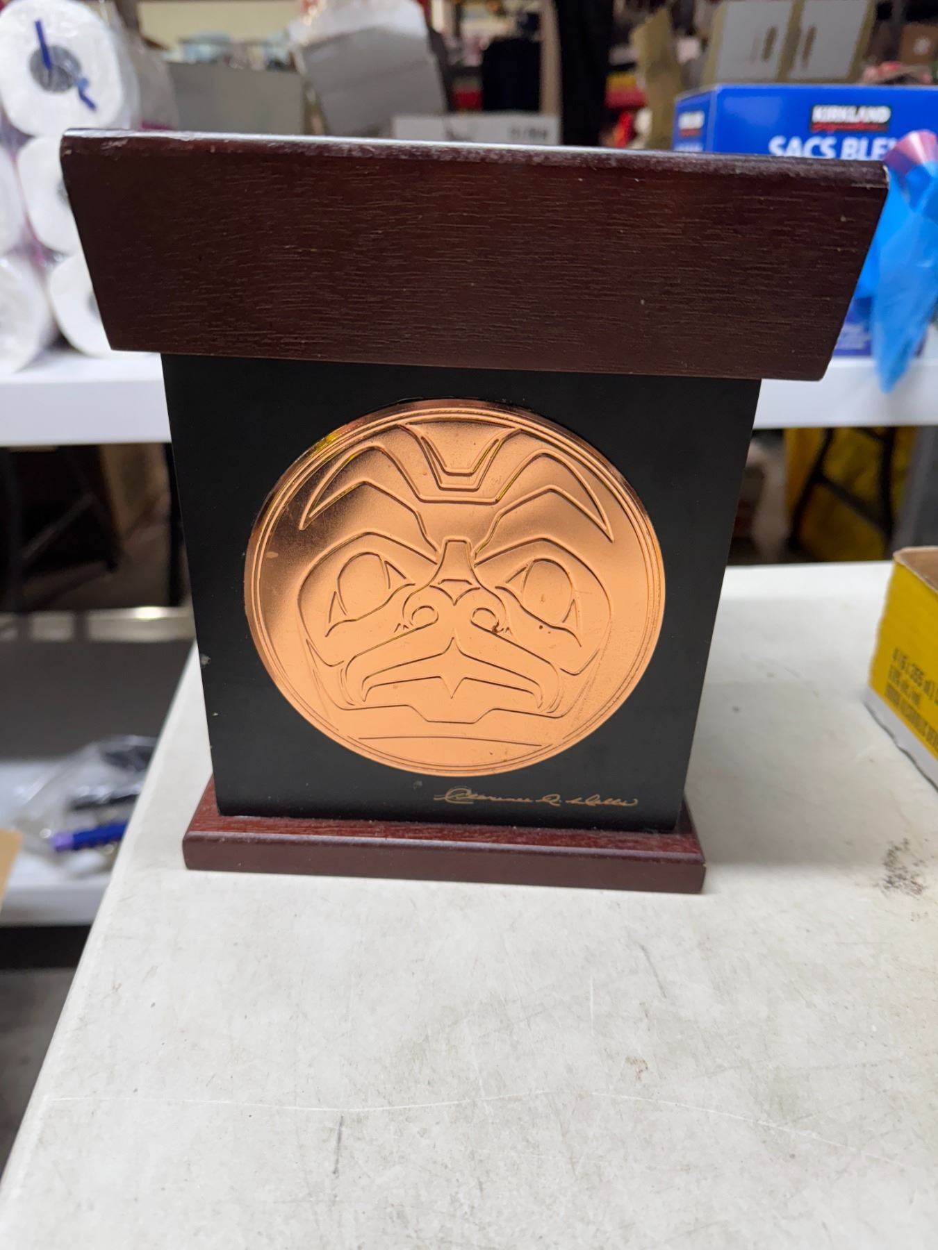 Haida bentwood lidded box with copper art by Clarence Wells.