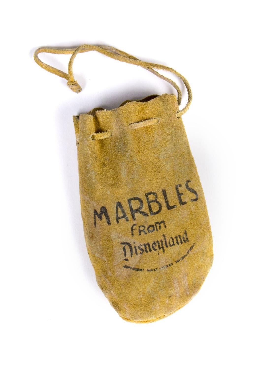 A "Marbles from Disneyland" Leather Pouch with Marbles.