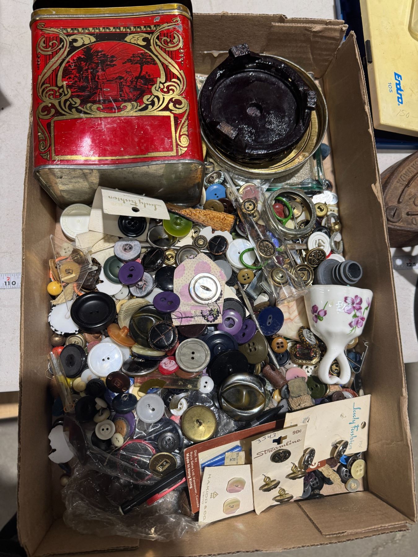 Vintage buttons and tin