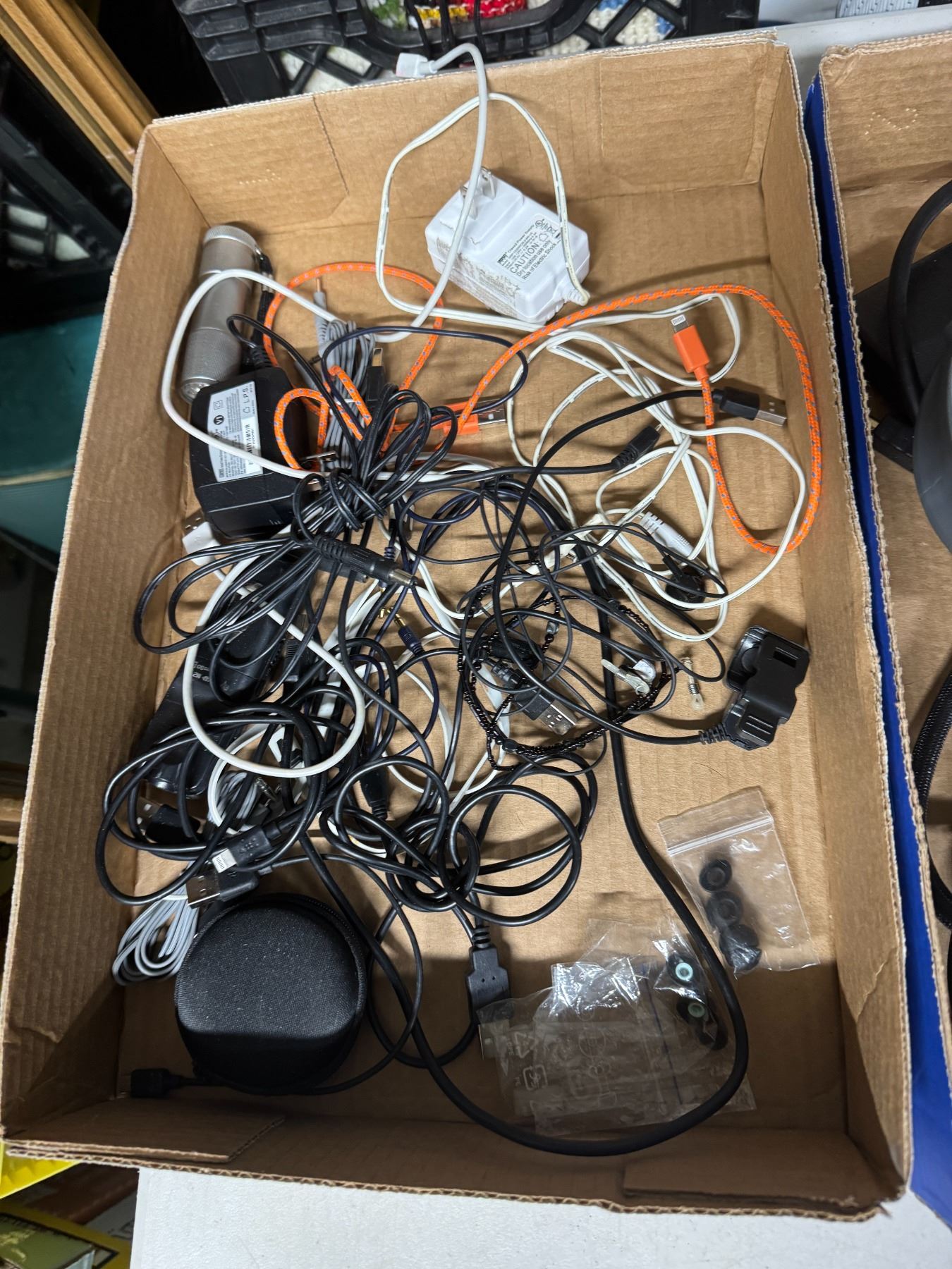 Assorted power cords, flashlight, and