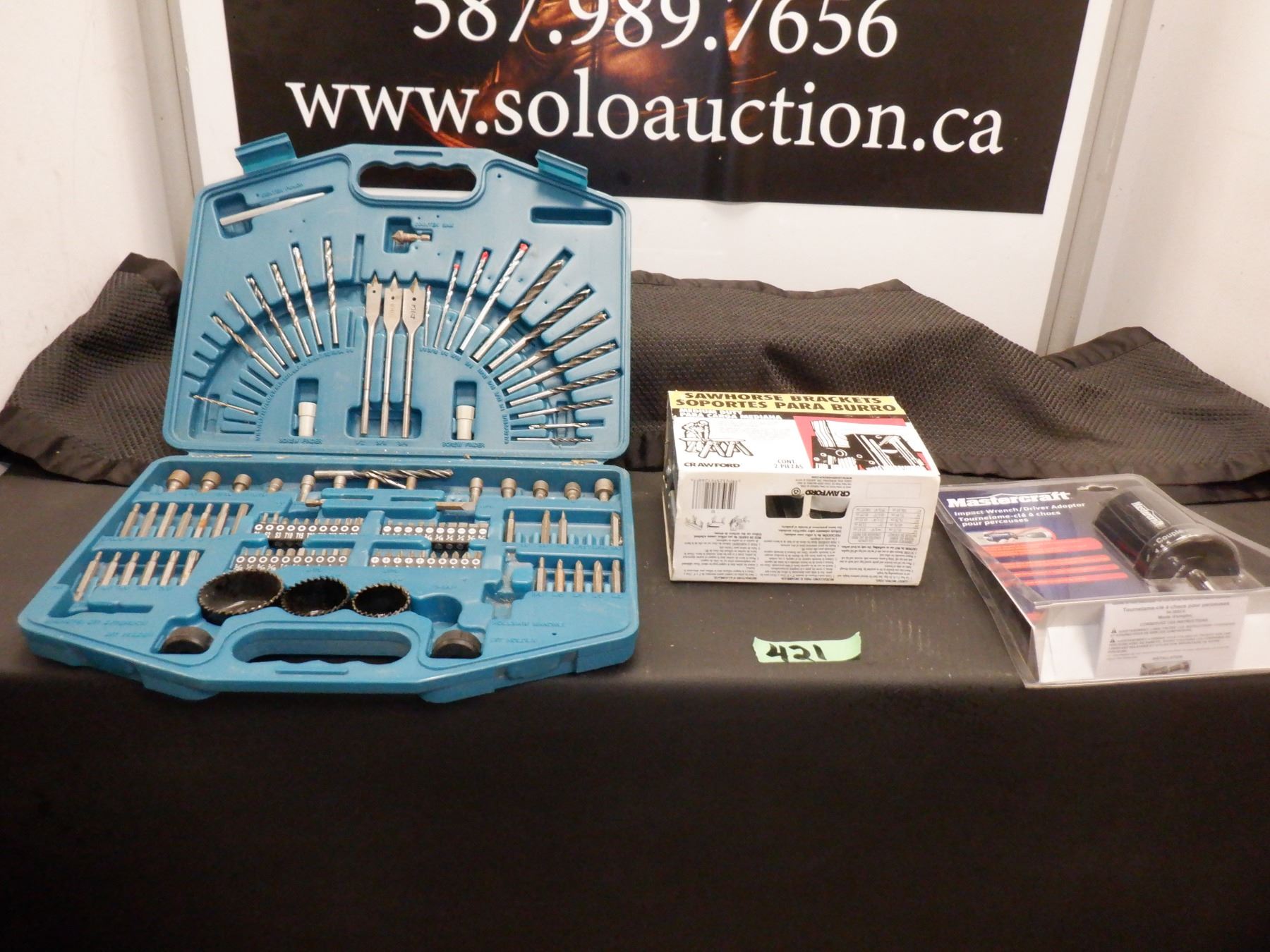 Tool items including bit set with bits and sockets, package of sawhorse ...