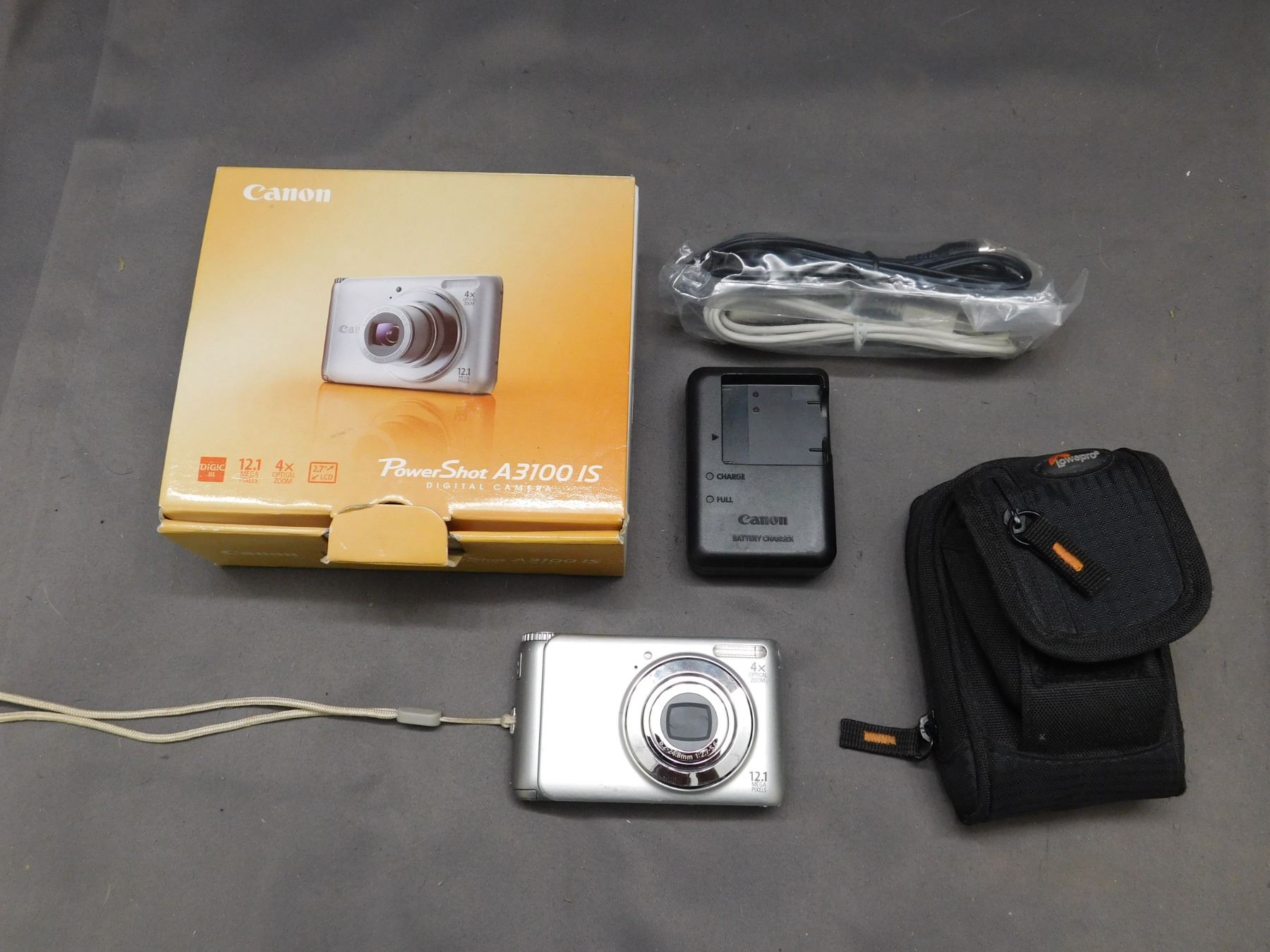 Canon Powershot A3100 IS Digital Camera w accessories, box, charger.