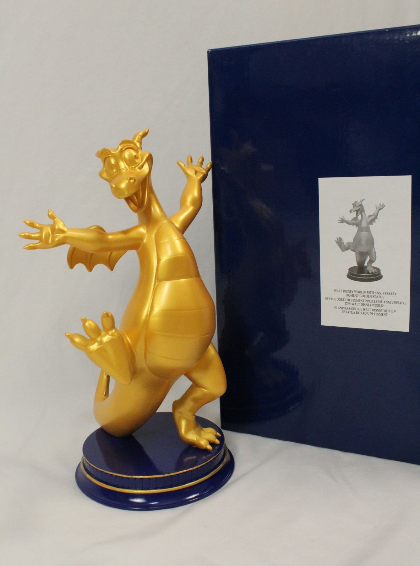 A Walt Disney World 50th Anniversary Figment Golden Statue.