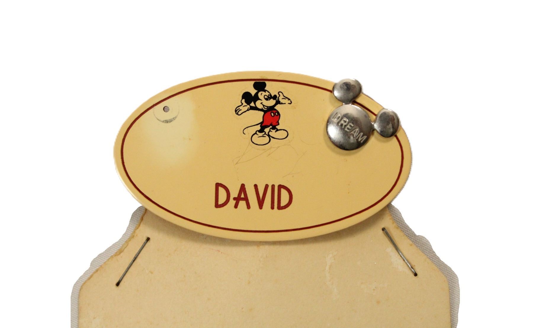 A 1980s Disneyland Cast Member "David" Name Tag with Silver DREAM Award.