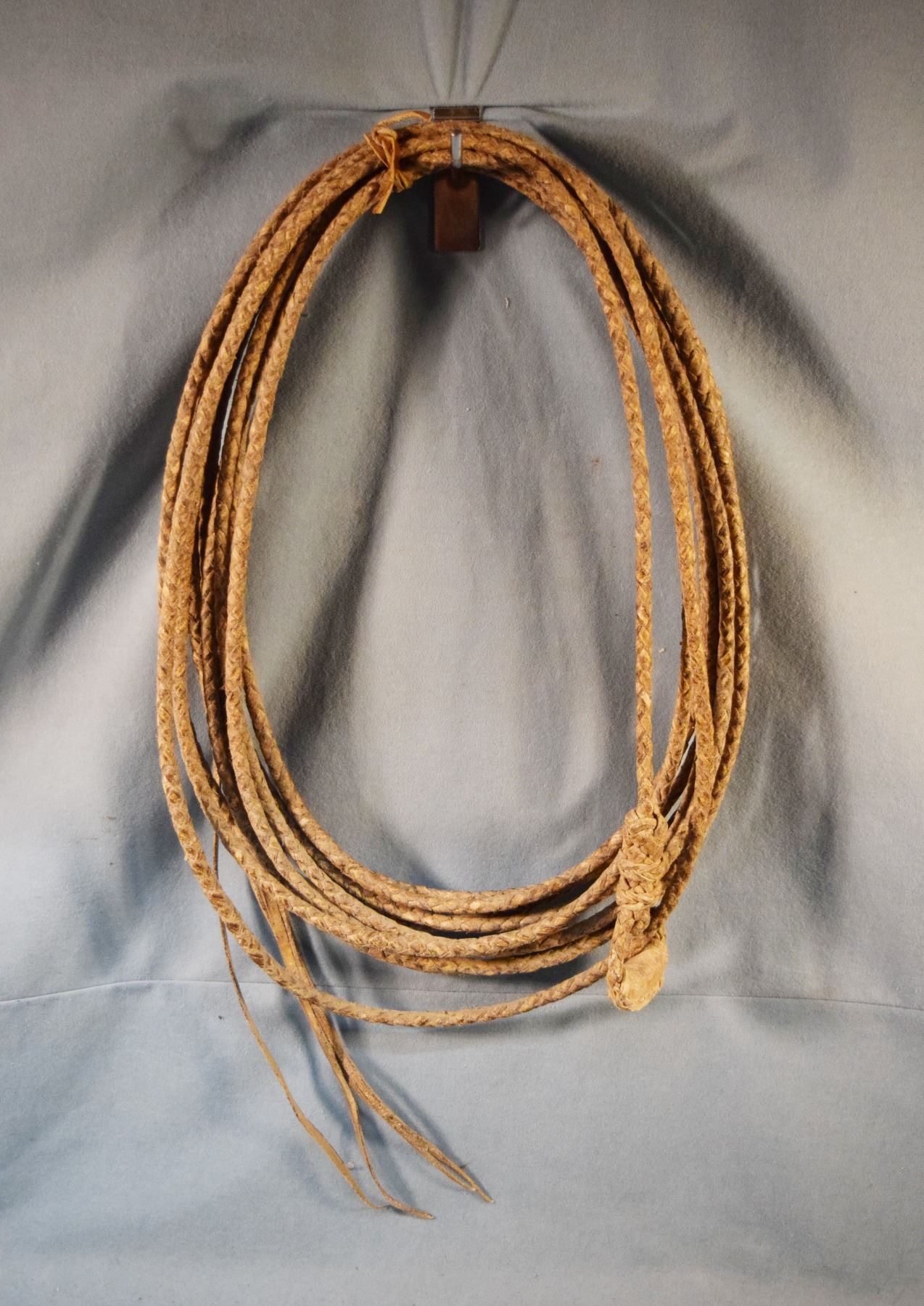 2 pcs: Braided rawhide rope, approx. 35' and Cactus lariat w/leather hondo