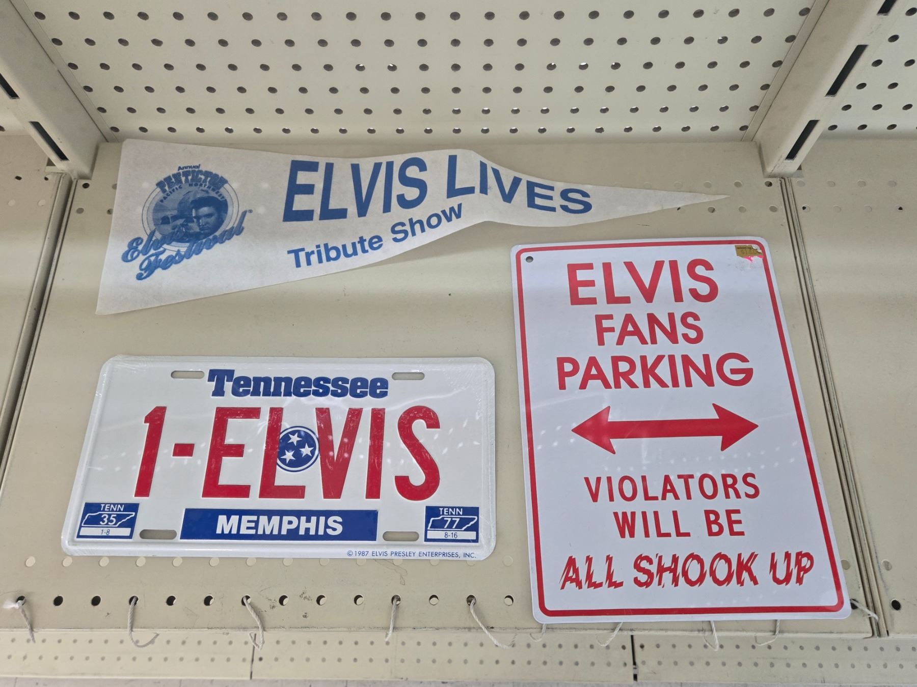 Elvis license plate, parking sign and banner
