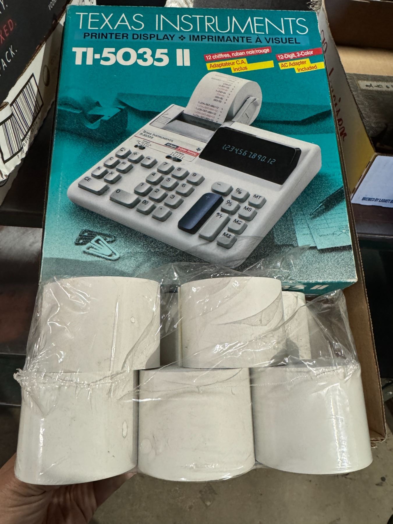 Texas instrument calculator with paper rolls