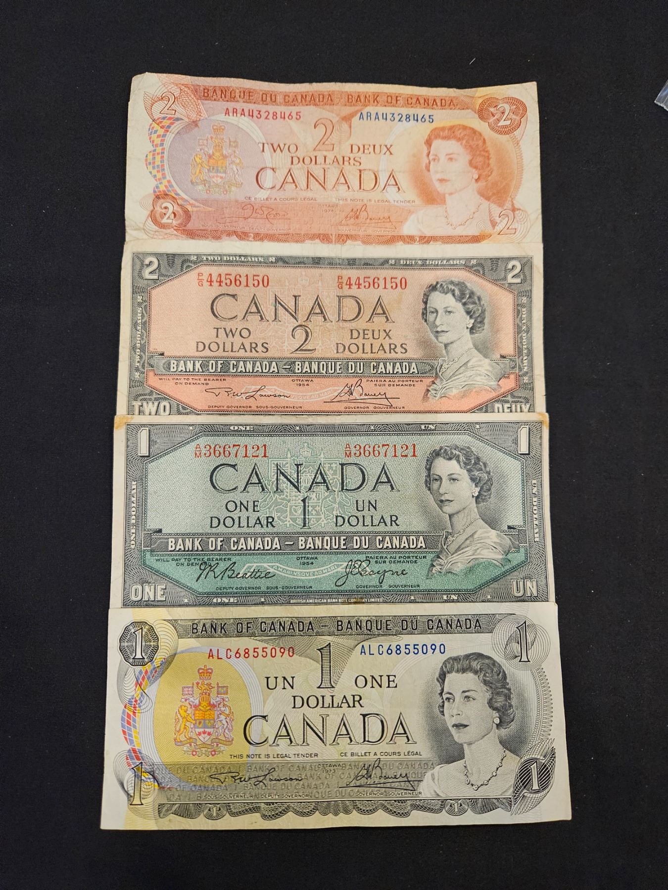 $1 Canadian bill x2, $2 Canadian bill x2