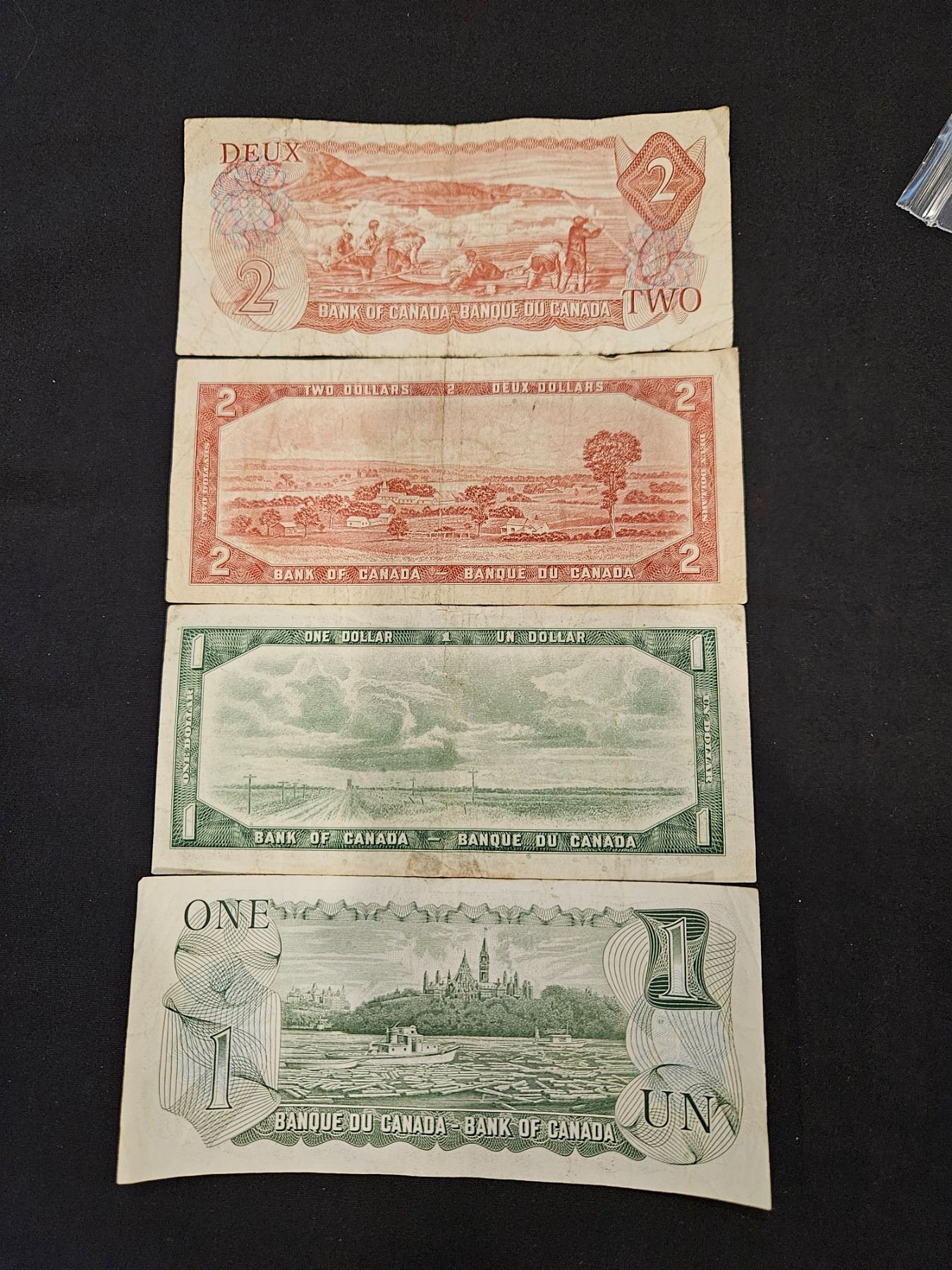 $1 Canadian bill x2, $2 Canadian bill x2