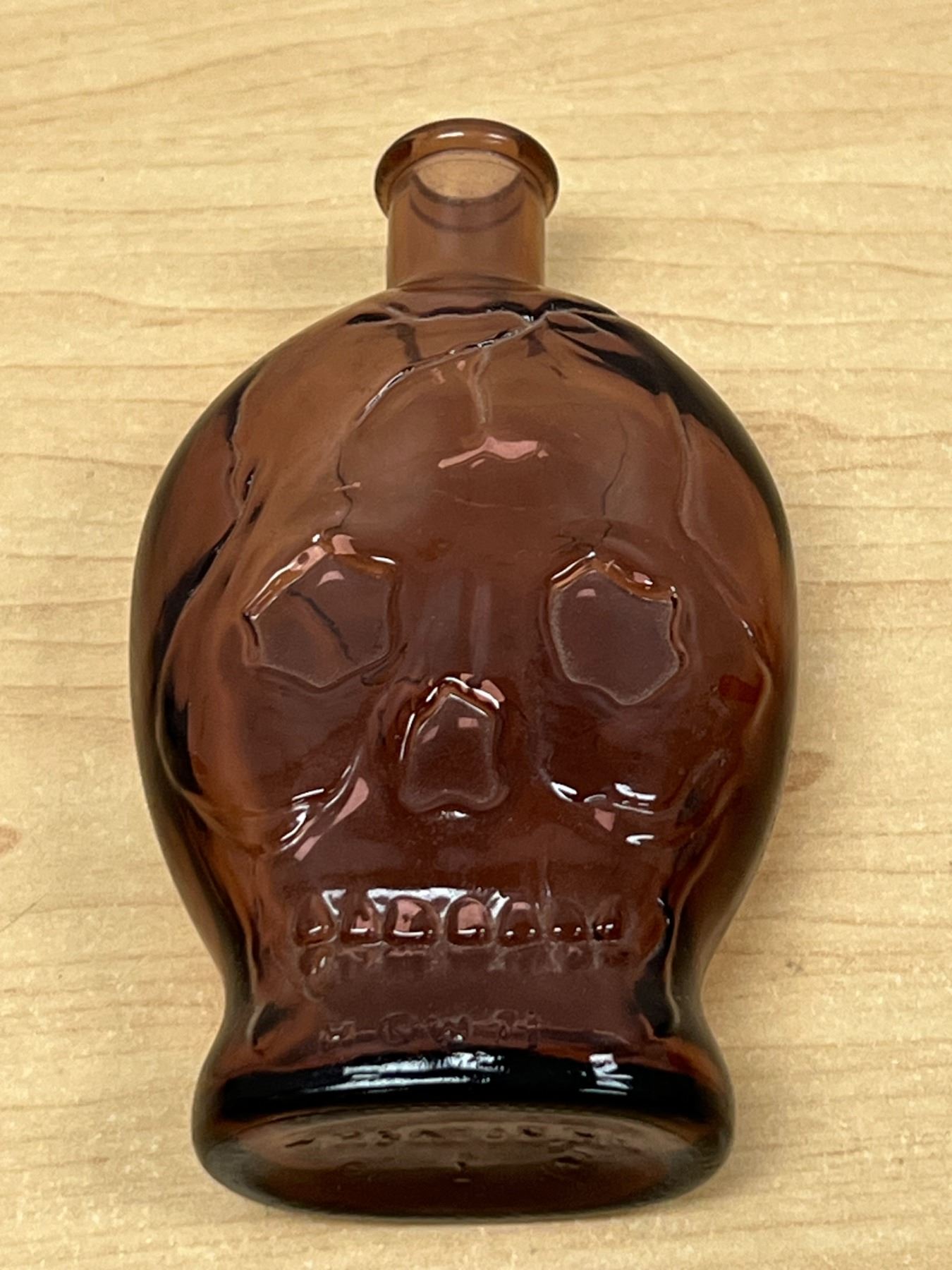 Unusual Embossed Skull Face Glass Bottle 5"