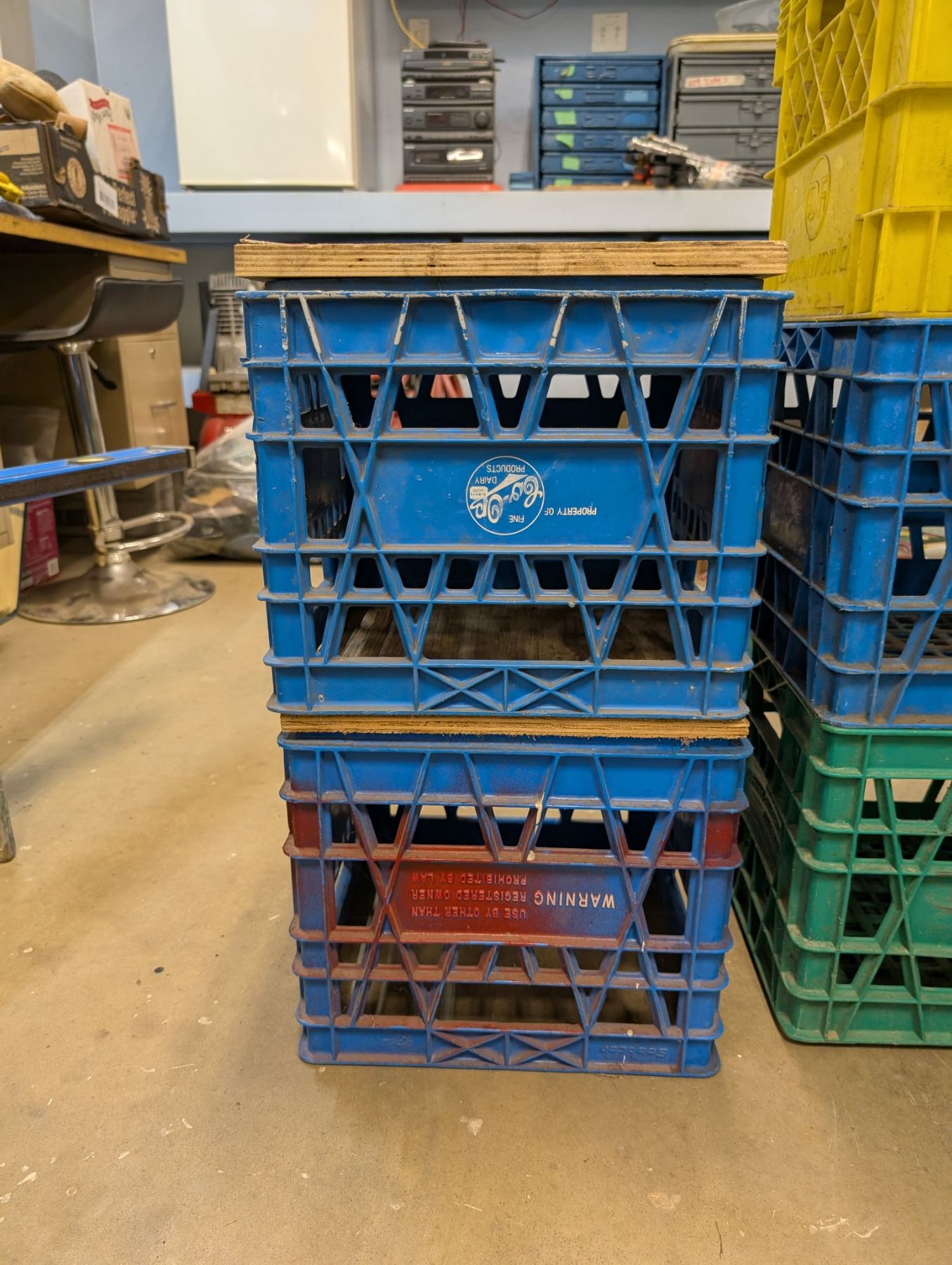 7 milk crates 2 have wood bottoms - Schmalz Auctions