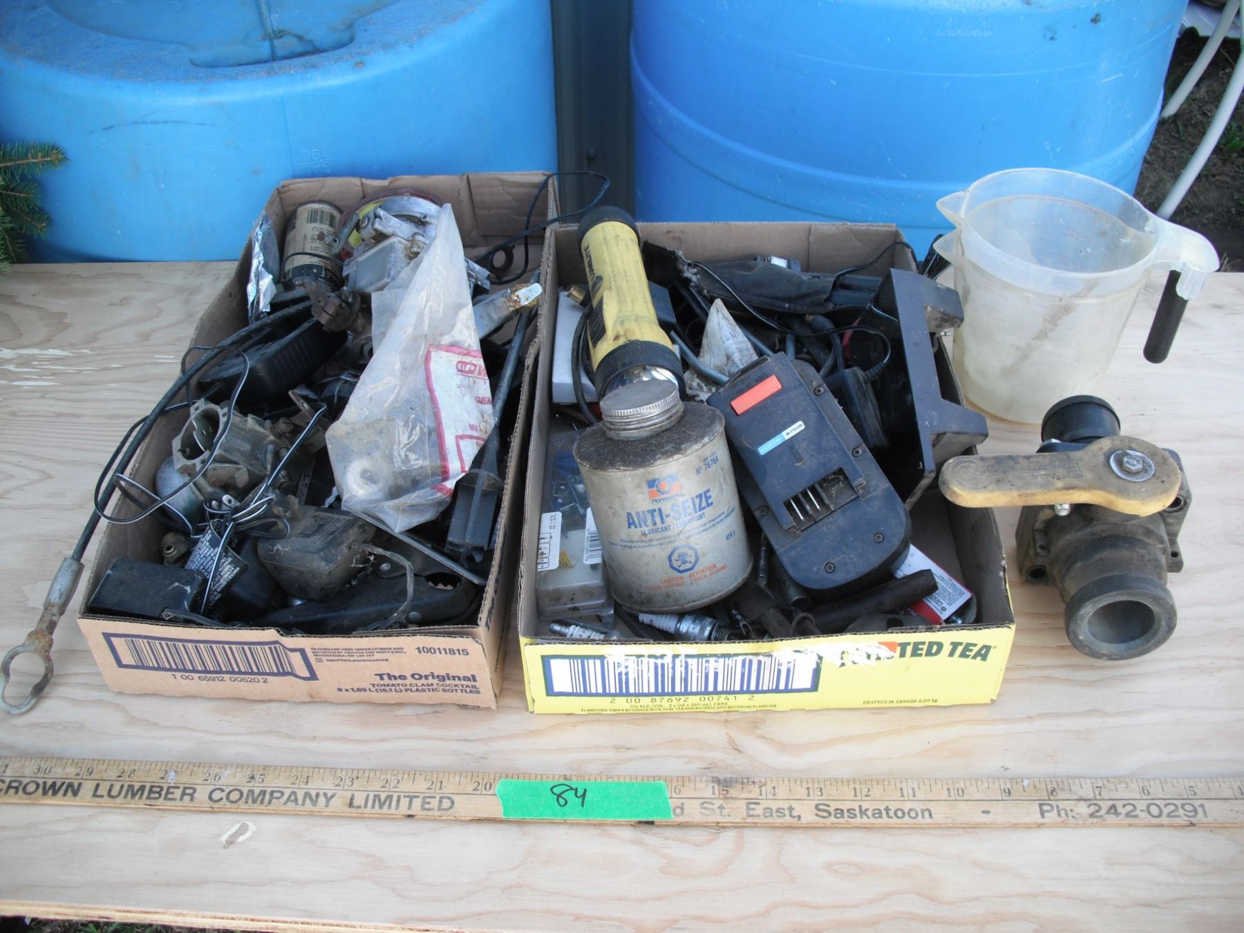 assorted hardware - carberators, hose valve, battery, cables, etc. - Schmalz Auctions