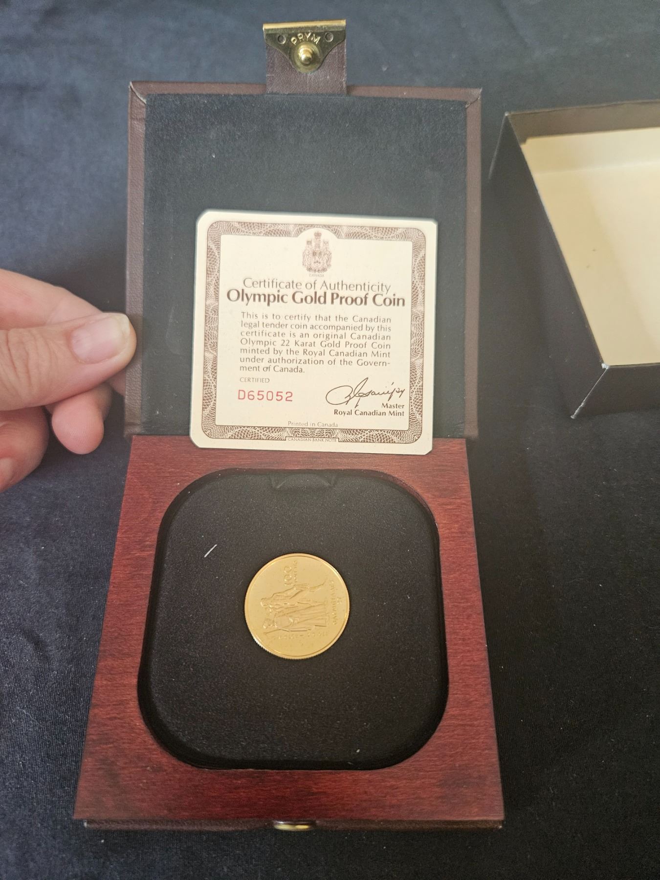$100 22K gold olympic coin
