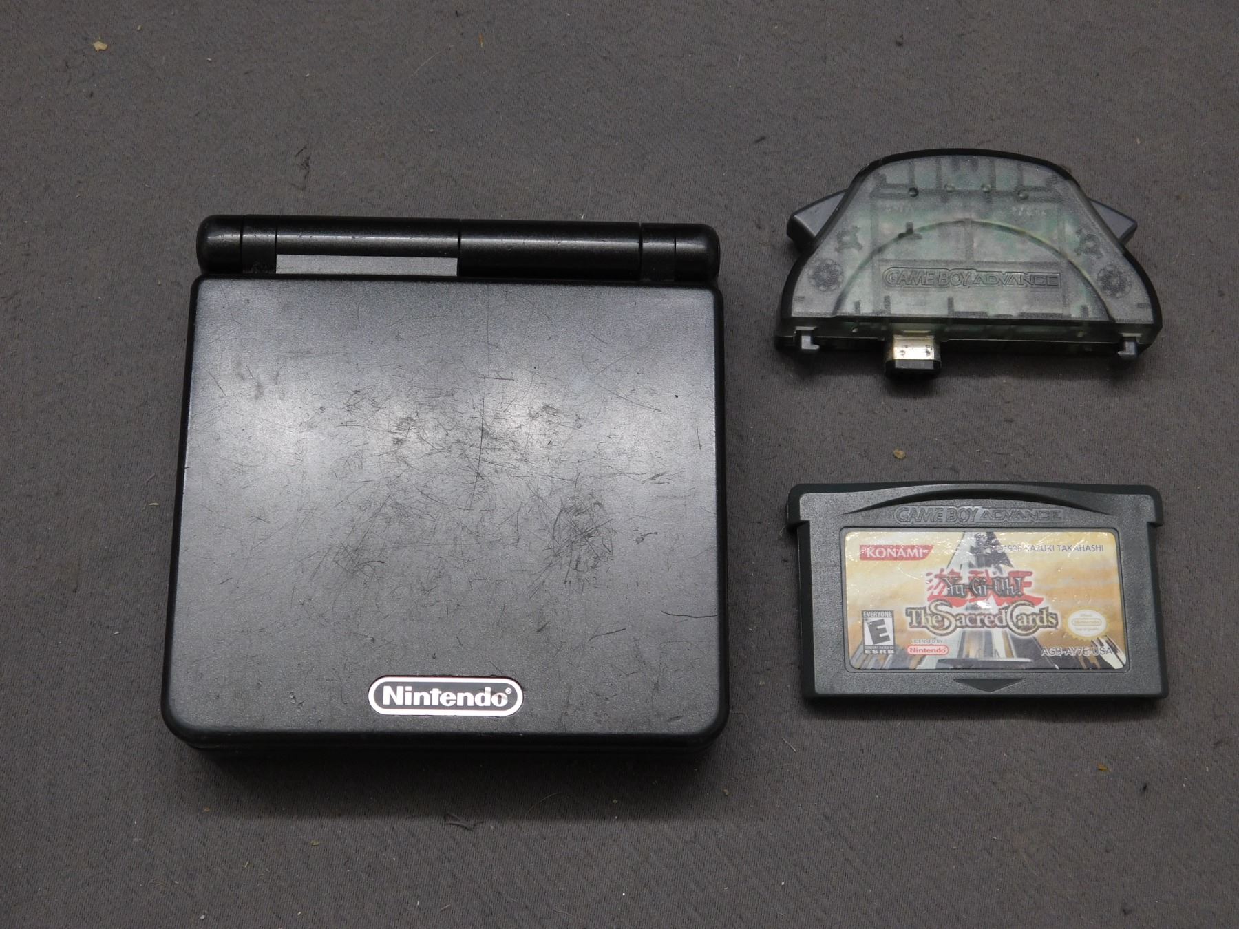 Nintendo Gameboy SP Black with Yu-Gi-Oh The Sacred Cards GBA Game and ...
