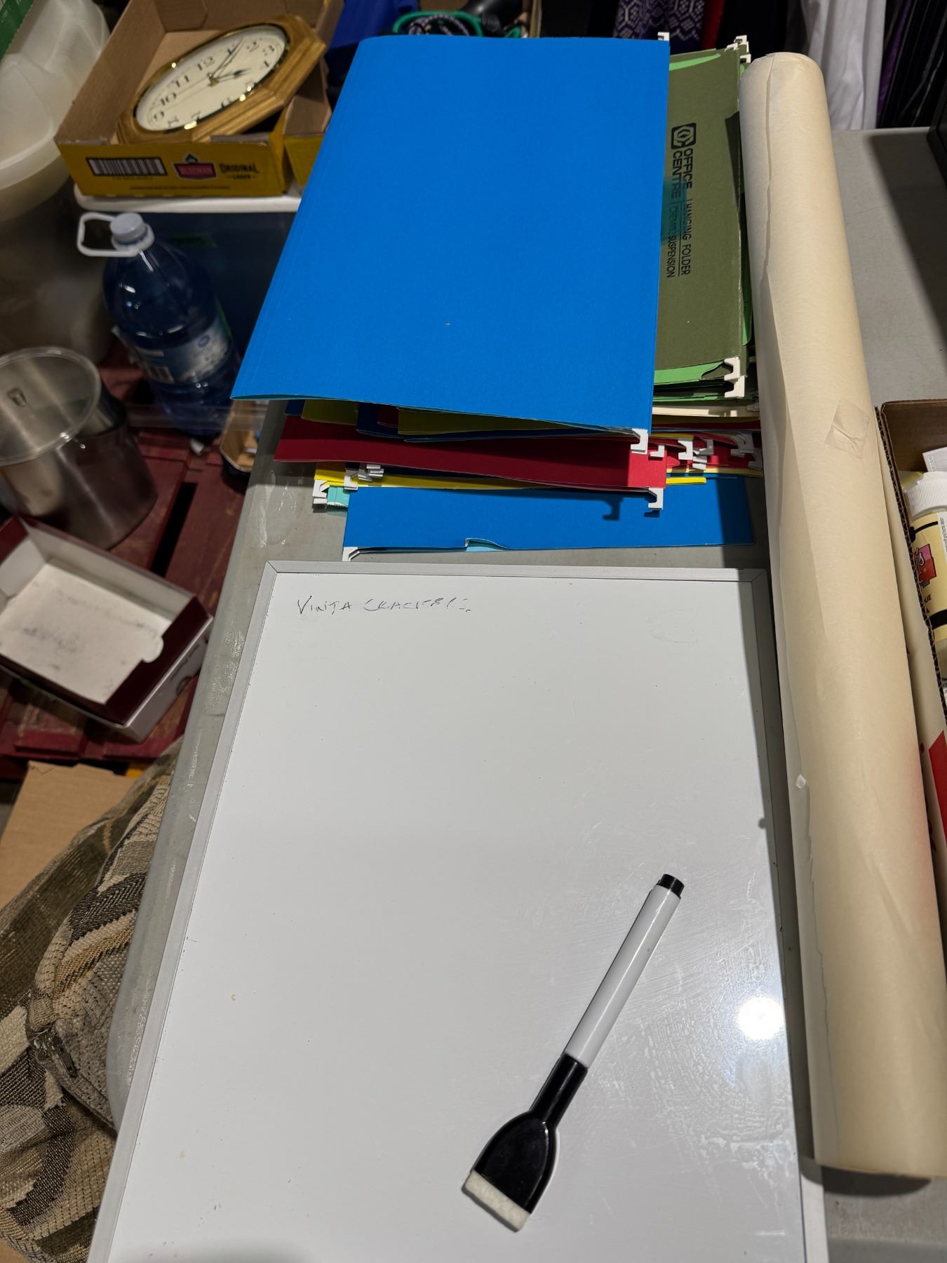 File folders whiteboard, and roll of paper