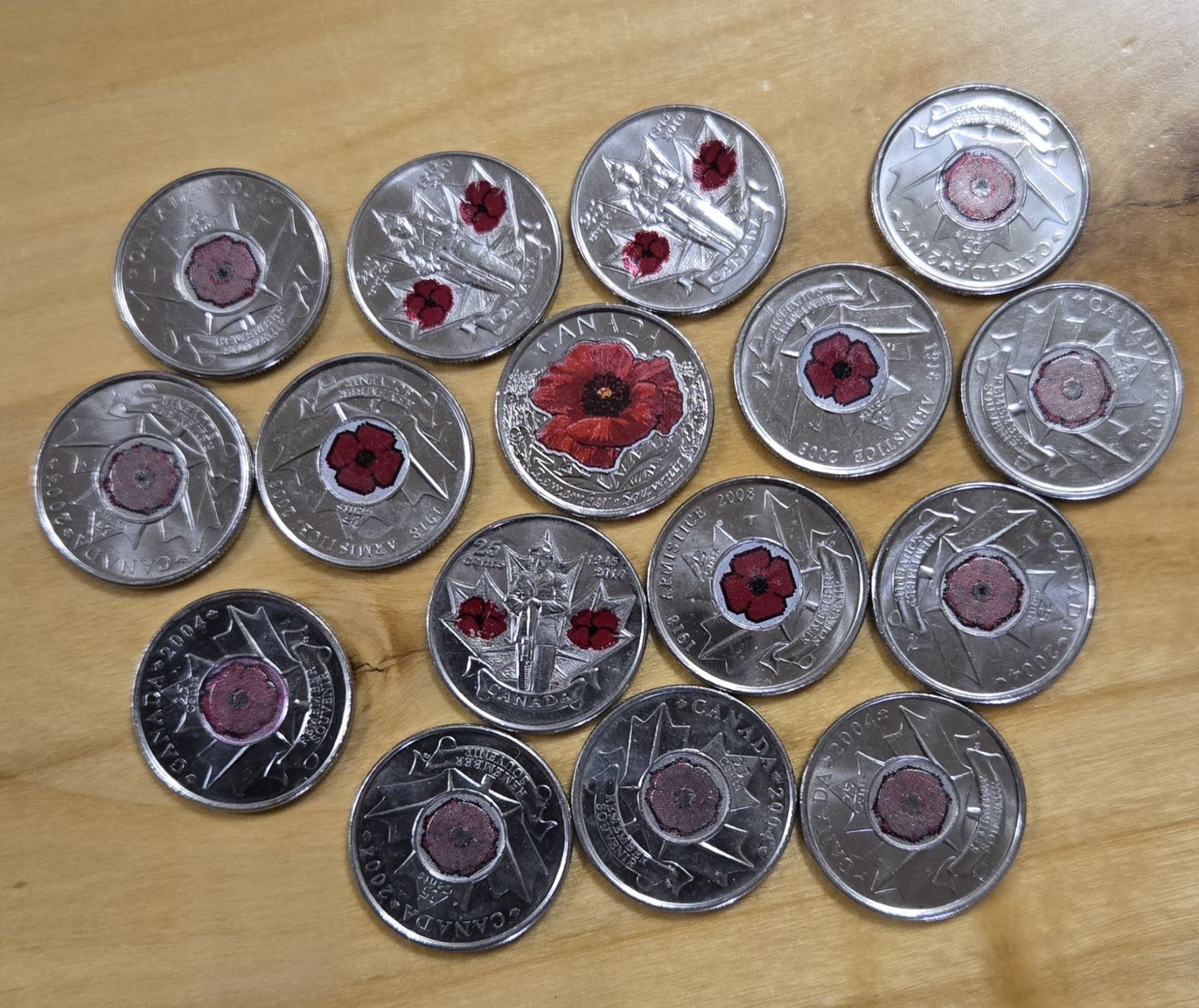 Sixteen Circulated Canadian Colorized Poppy Quarters