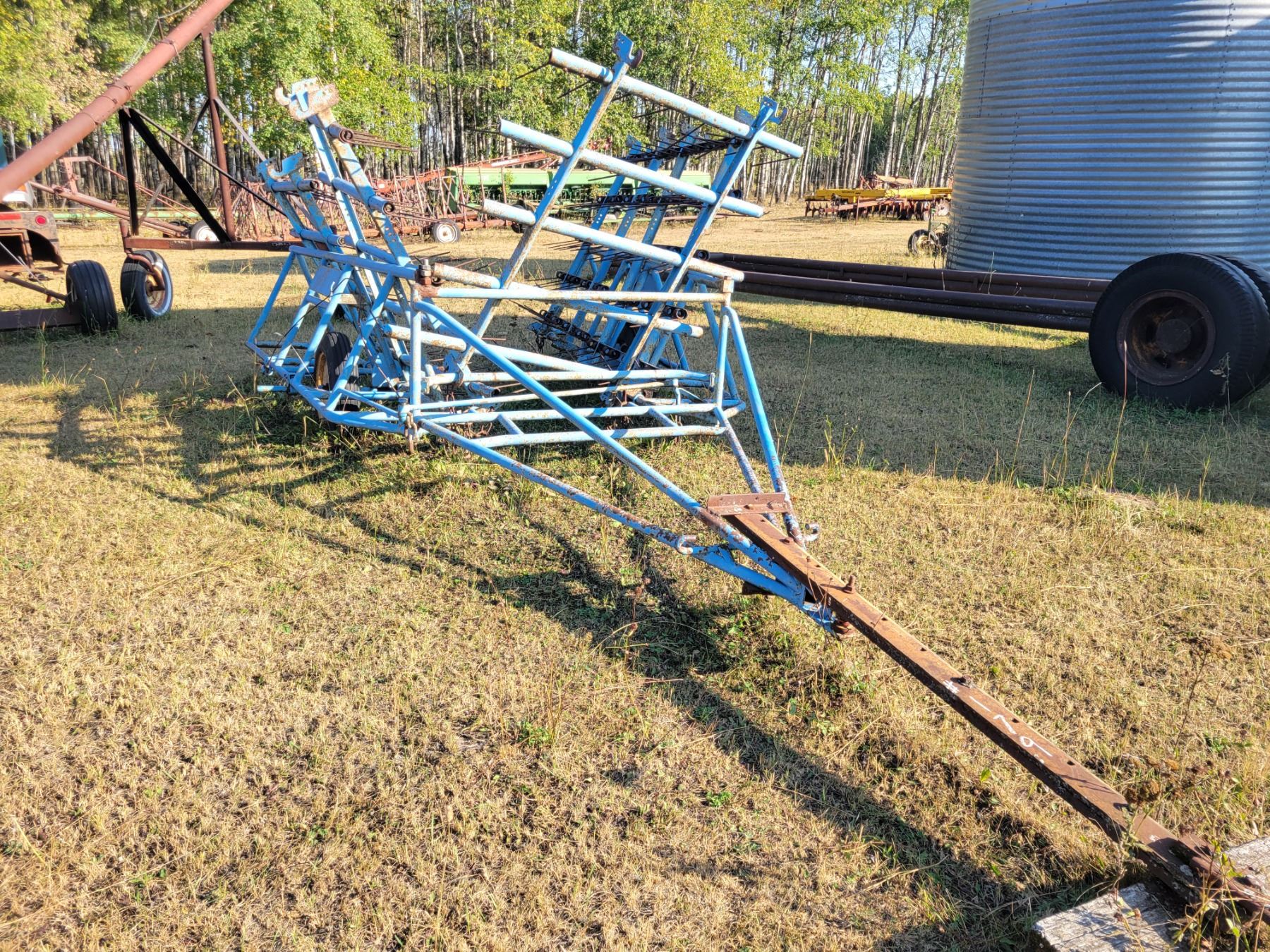 Melroe tine harrow cart, 25 ft manual hang up