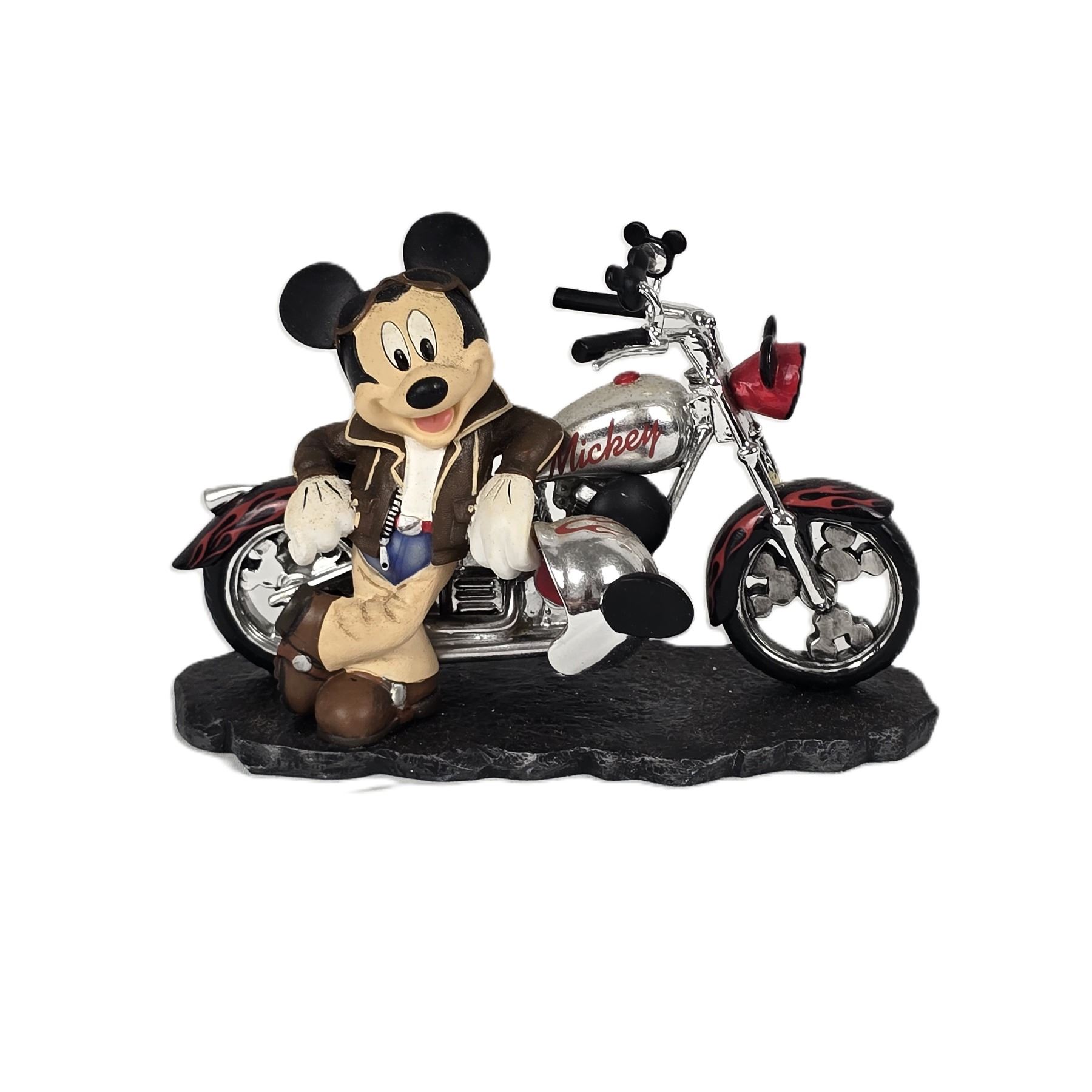 A Mickey Mouse In Front Of A Motorcycle Figurine.
