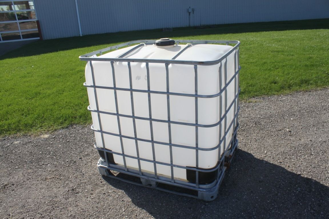 1000 litre plastic tote in steel cage