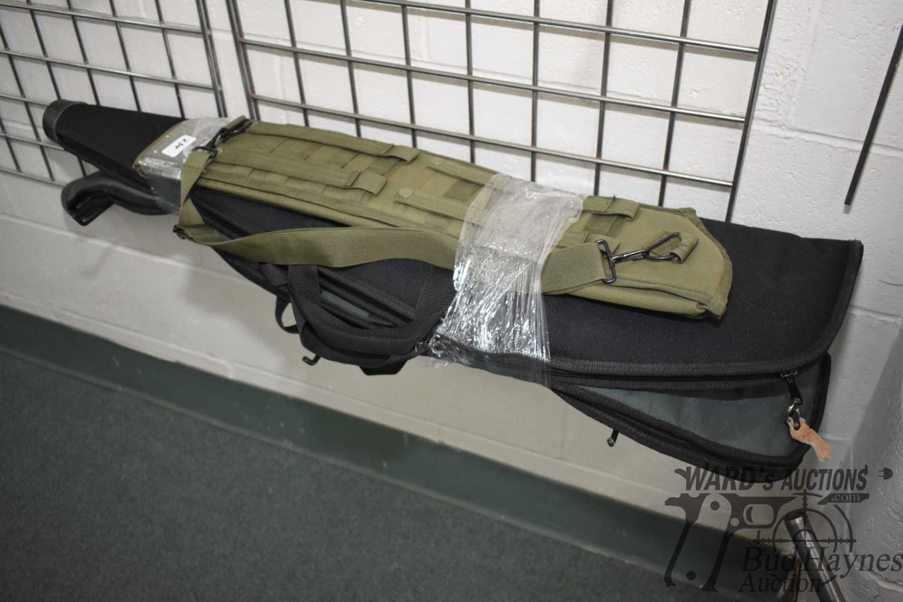 Two soft gun cases and a webbed riffle scabbard