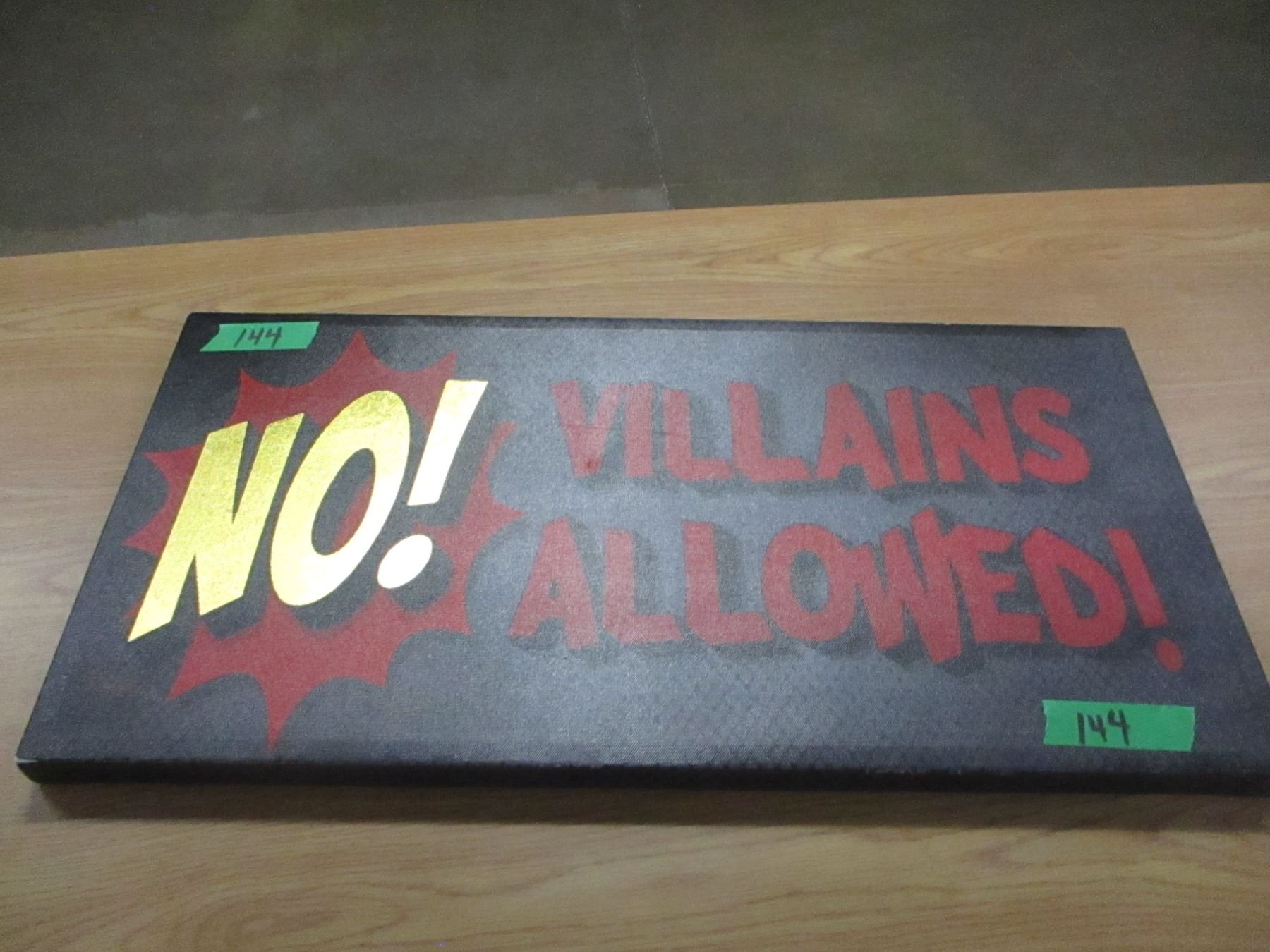 "NO VILLAINS ALLOWED" SIGN