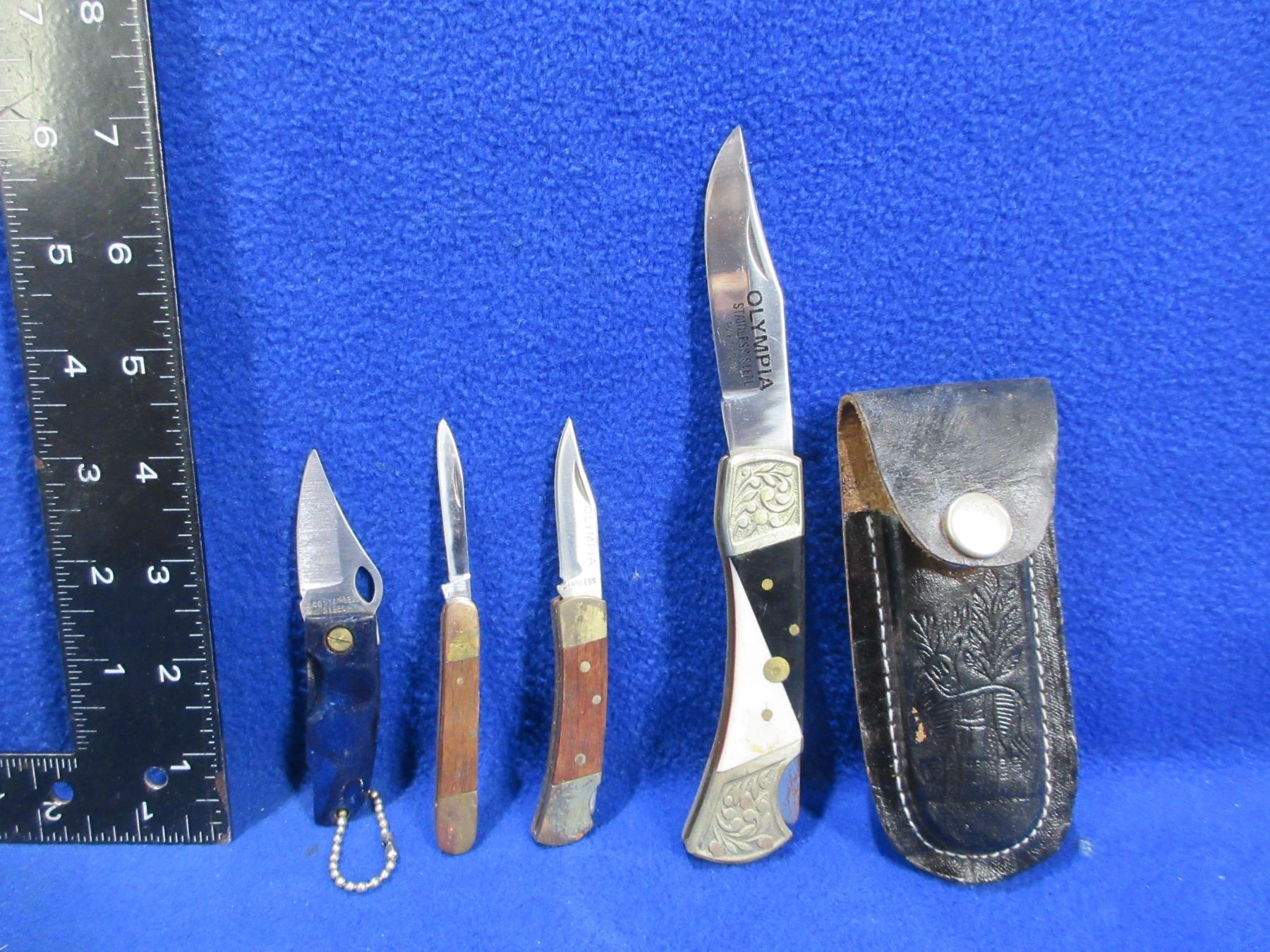 4 Folding Blade Knives - 3 are Lock Blade, 1 Has a Leather Sheath