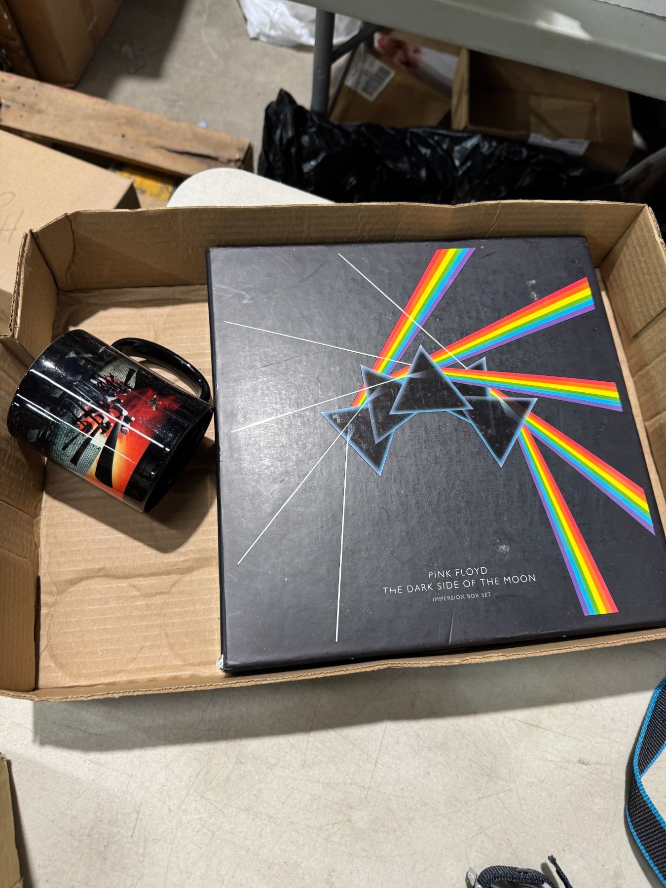 Pink Floyd, the dark side of the moon box set and a mug