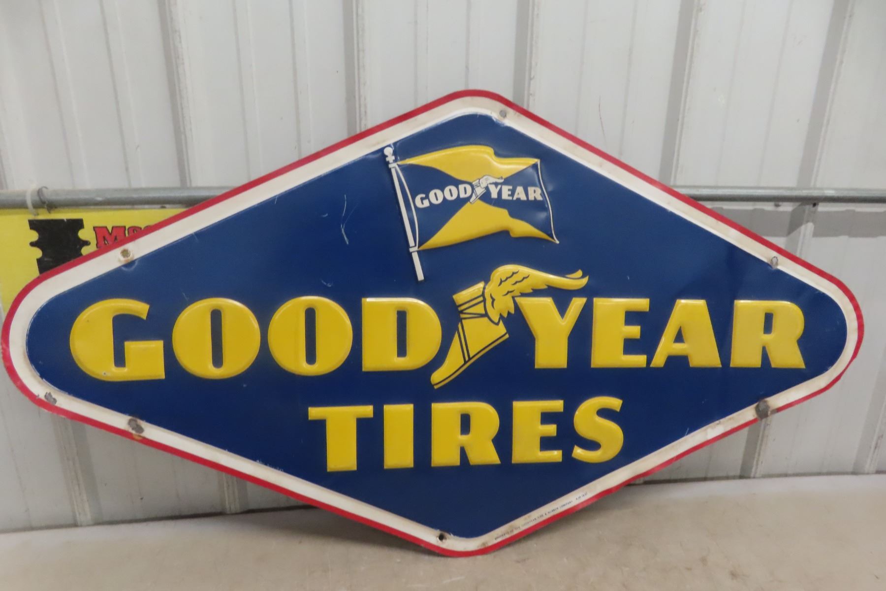 Goodyear Embossed Metal Tin Sign, 1957, 48" x 26 1/2"
