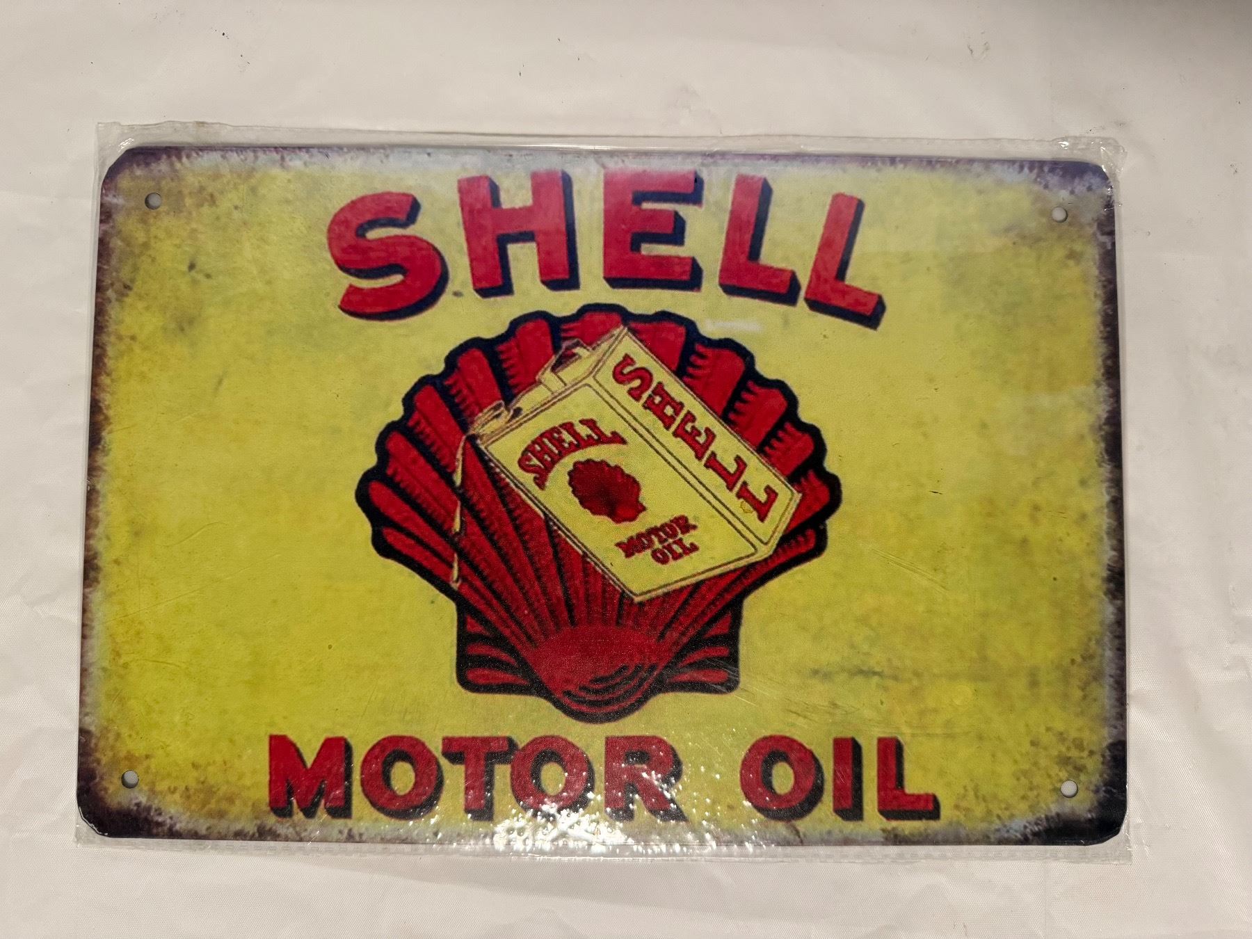 Vintage-style metal Shell Motor Oil advertising sign