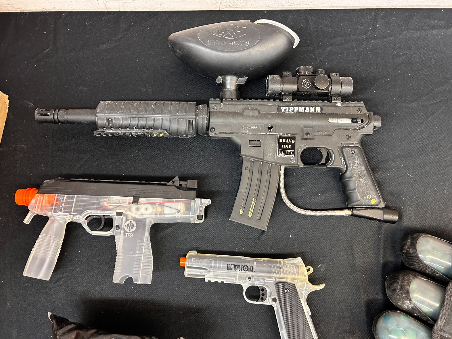 Box of Paintball Guns, Paint Balls and Accessories
