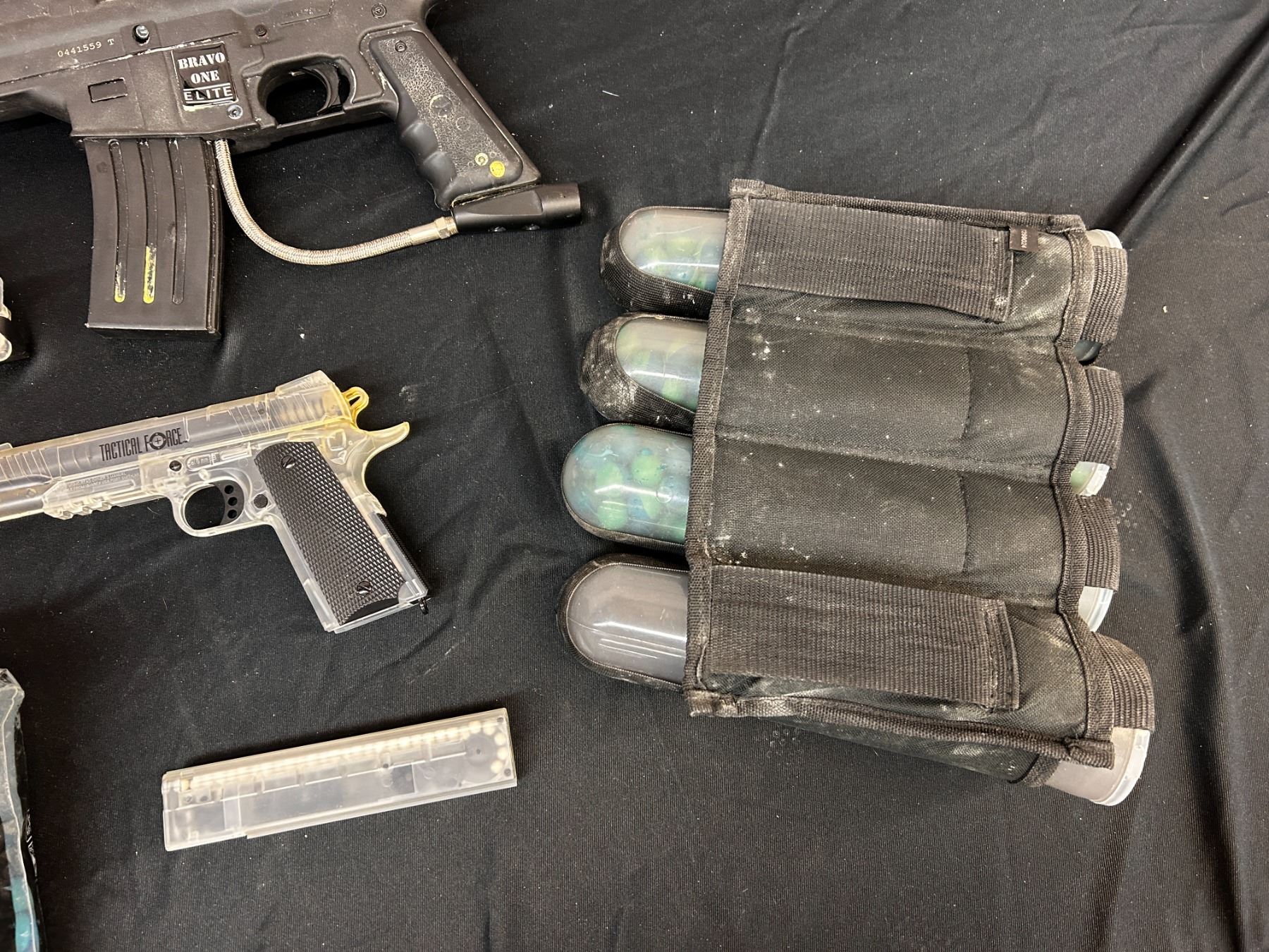 Box of Paintball Guns, Paint Balls and Accessories