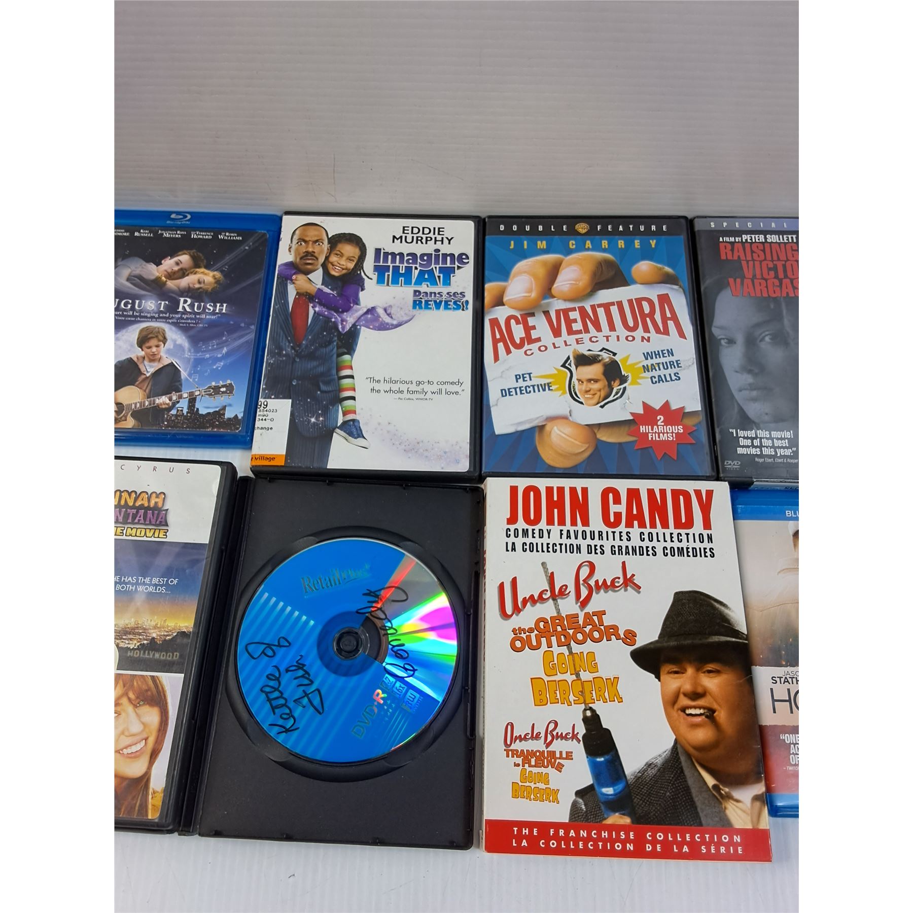 (10) DVDS: The Heat, John Candy "Uncle Buck", Ace Ventura, Misc ...