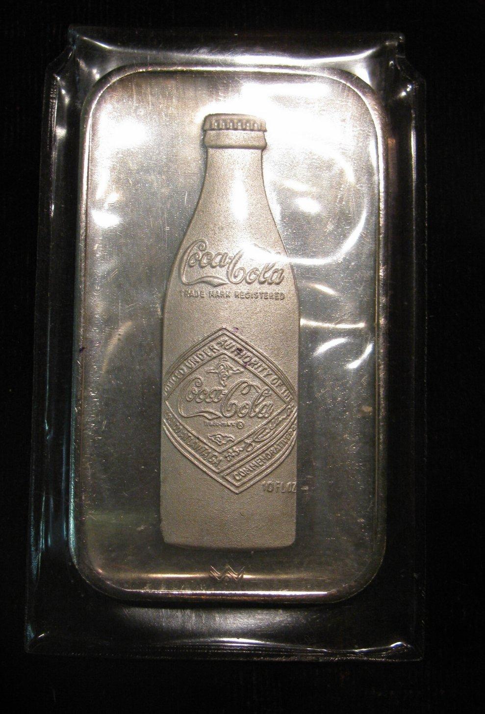 25. 1900-1975 75th Annivesary Coca-Cola One Ounce Silver .999 fine Ingot.