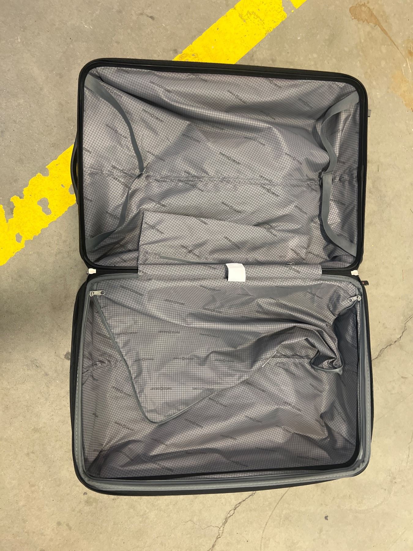 Swiss Gear Silver Hard-Shell Rolling Suitcase With Zipper Closure