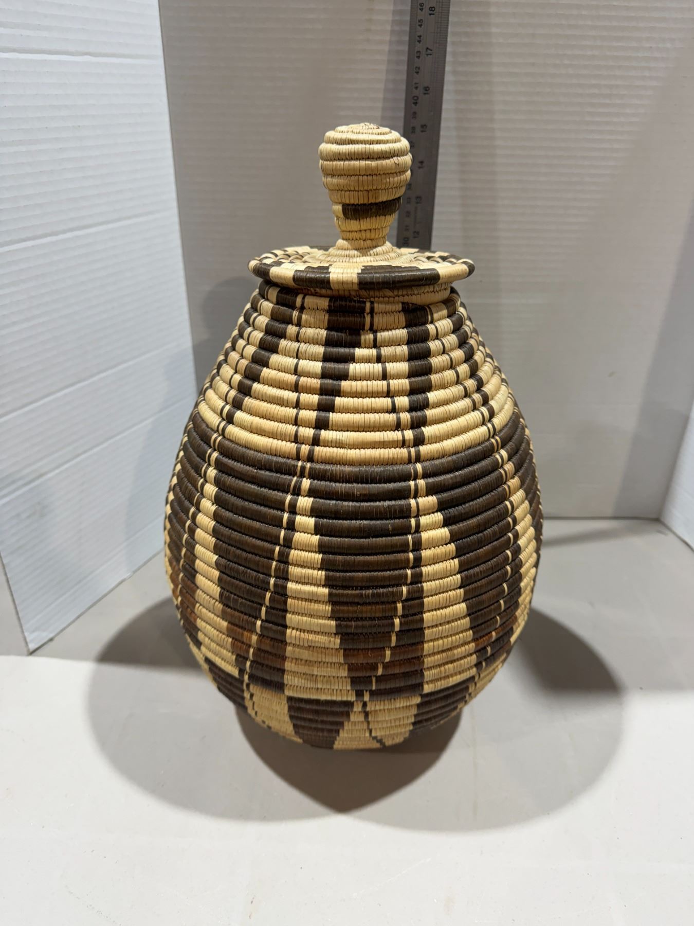 Zulu Ukhamba, a traditional handwoven lidded basket
