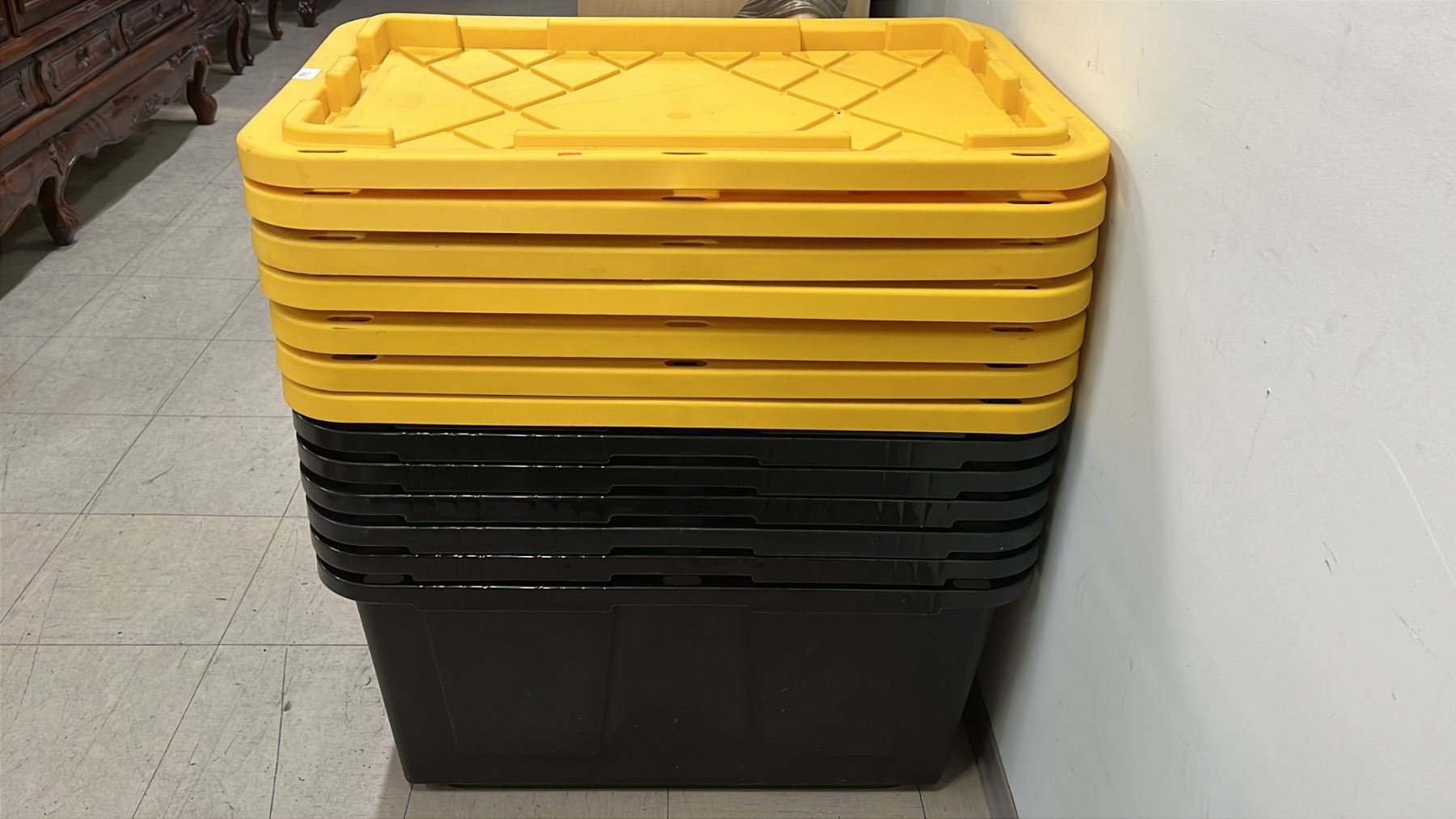 STACK OF (7) LARGE BLACK TOTES WITH YELLOW LIDS - Able Auctions
