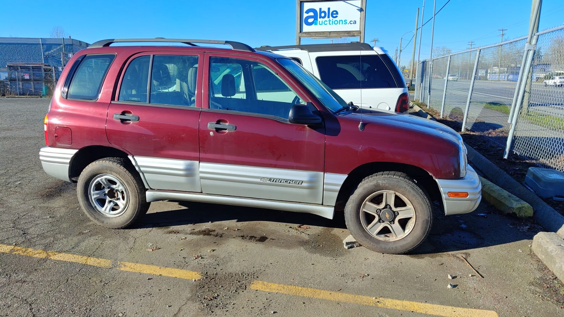 2002 CHEVROLET TRACKER, 4DRSW, RED, VIN 2CNBJ13C326930496, - Able Auctions