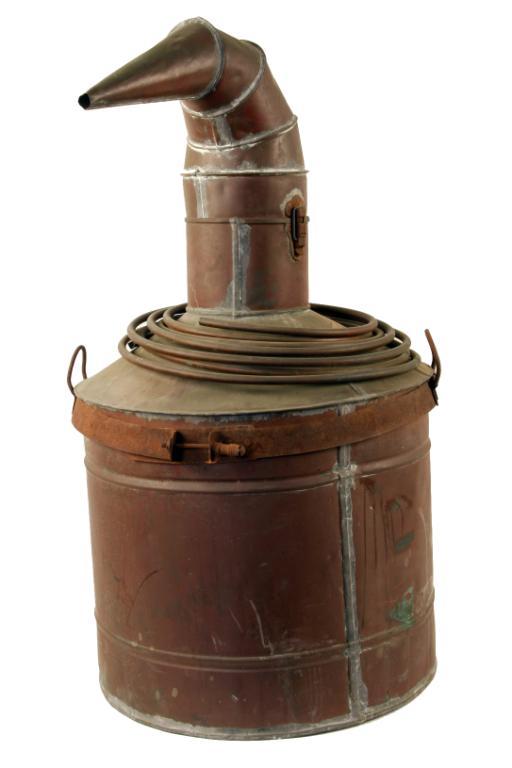 Old Antique Copper Whiskey Still with coil tubing.