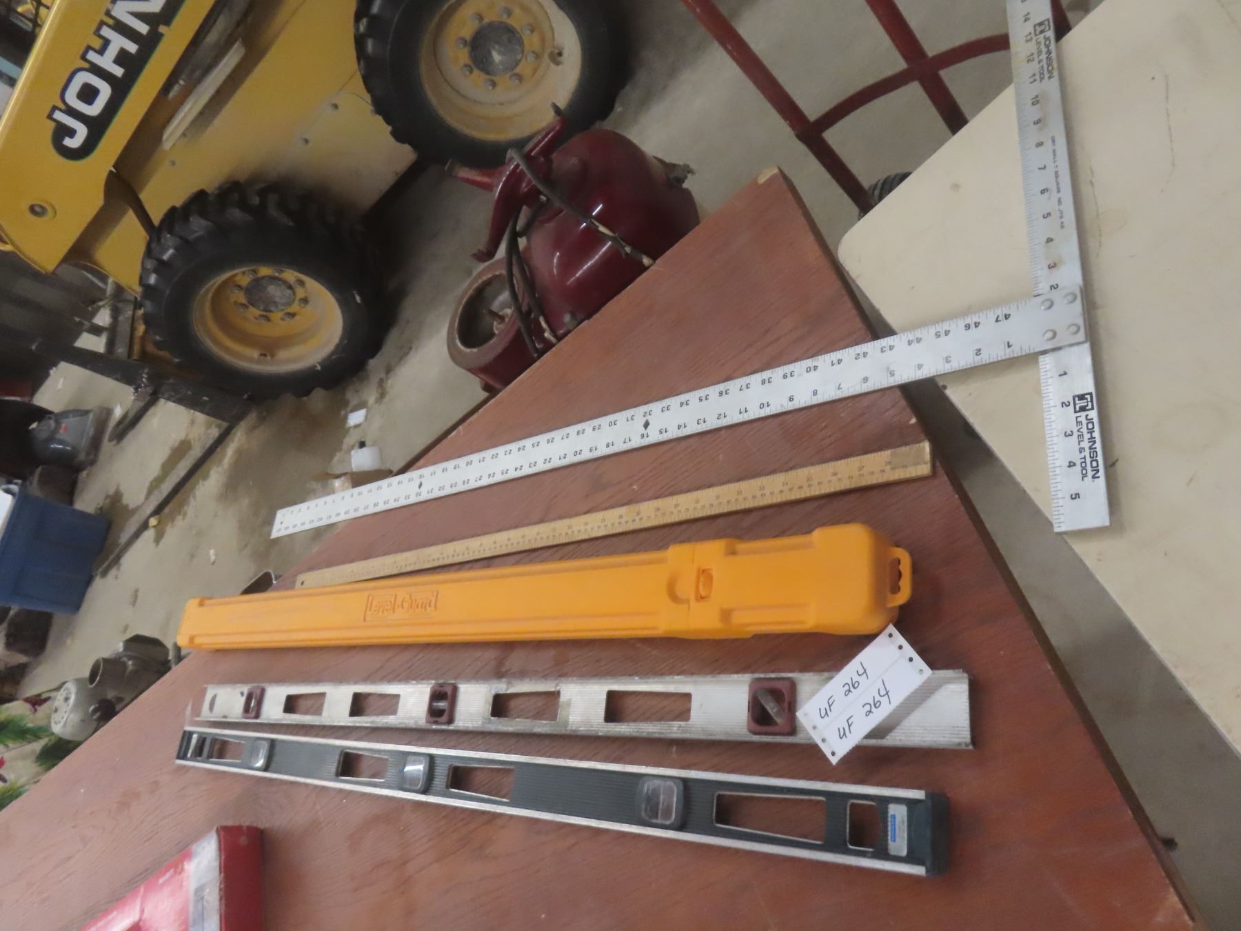 Three Levels Including 48 Inch Level T Square and Meter Stick