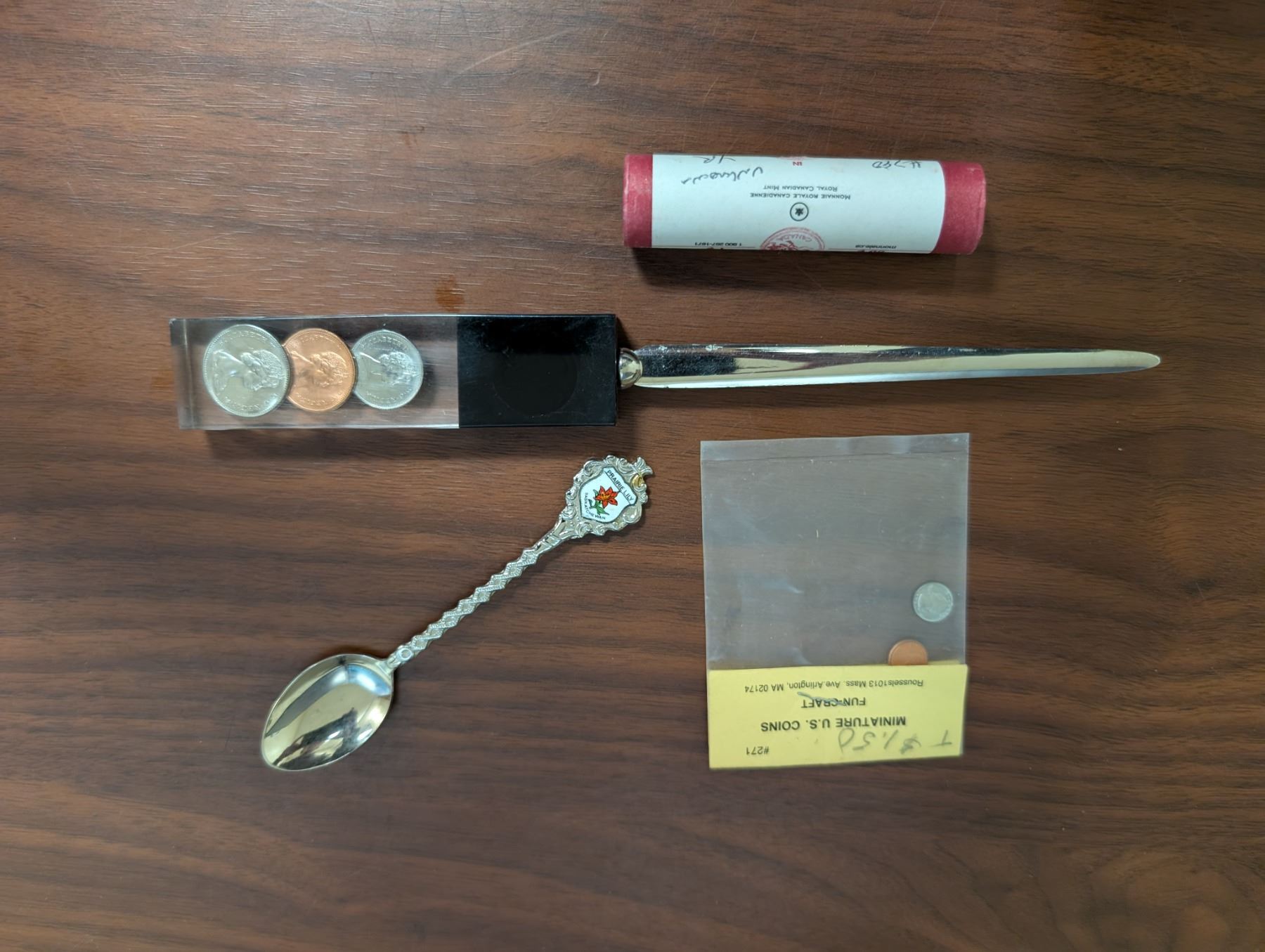 Letter Opener With Coins, Roll of Pennies, and etc. Lot - Schmalz Auctions